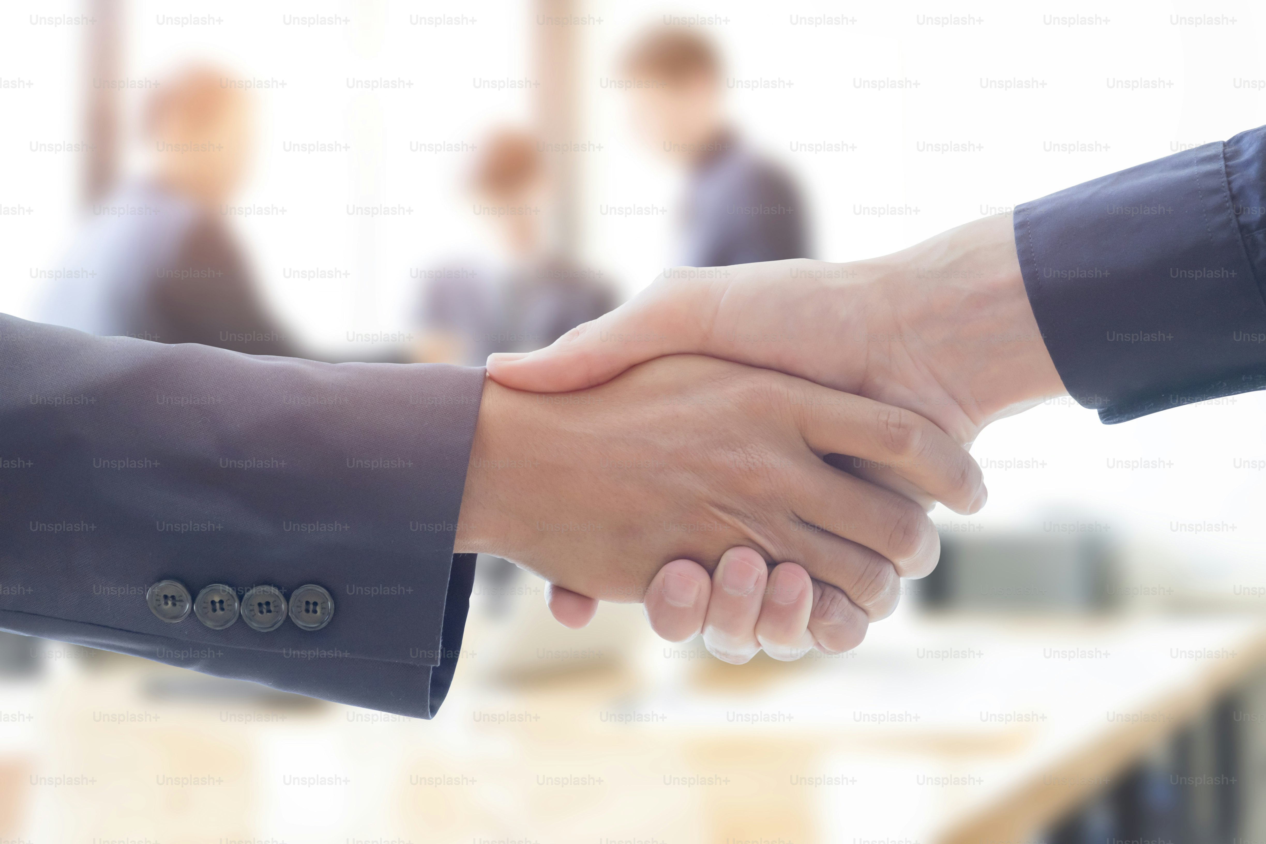 Businessmen handshake and business people ; success, dealing, greeting ...