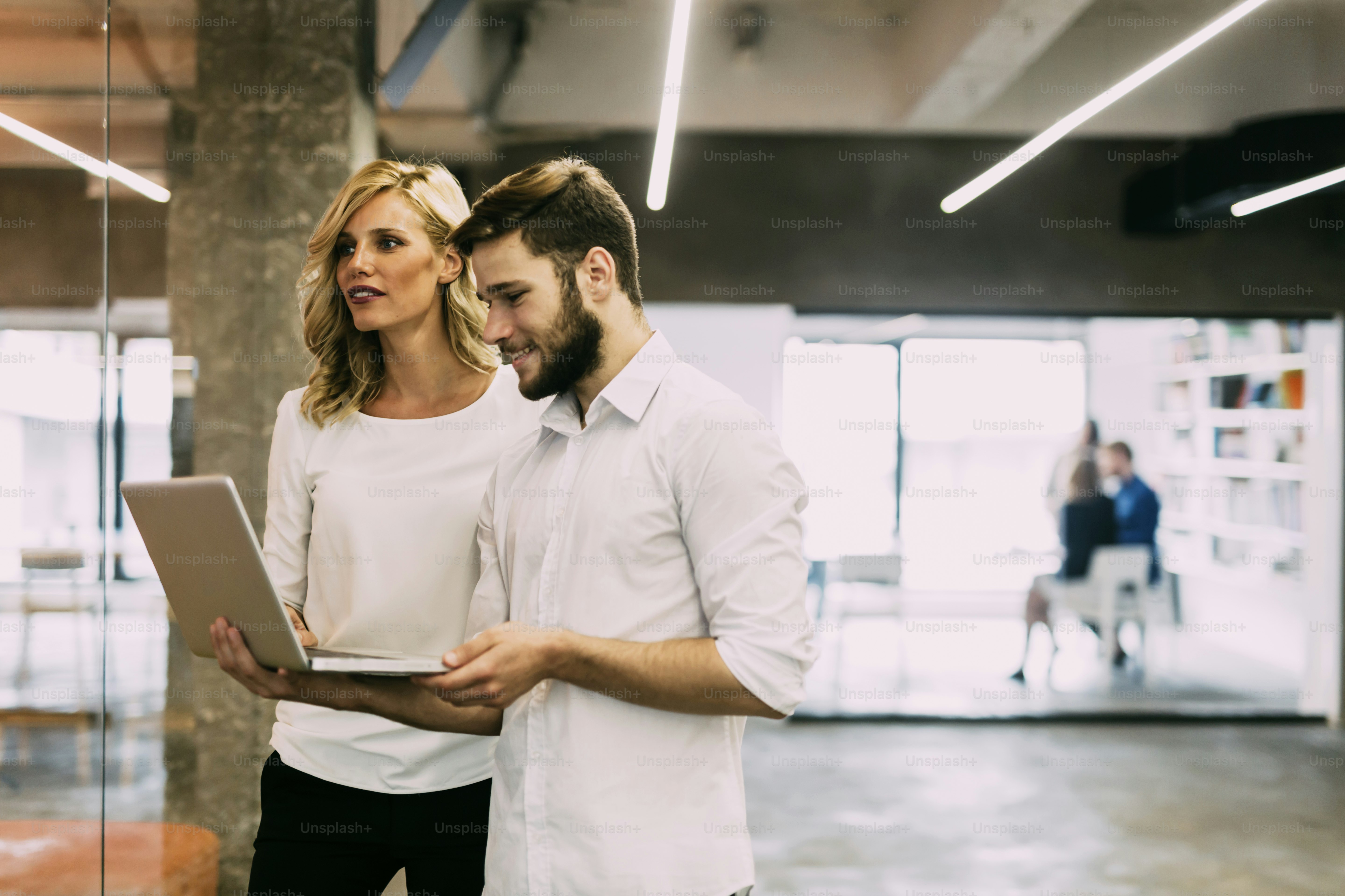 Smart colleagues brainstorming in the office photo – Teamwork Image on ...