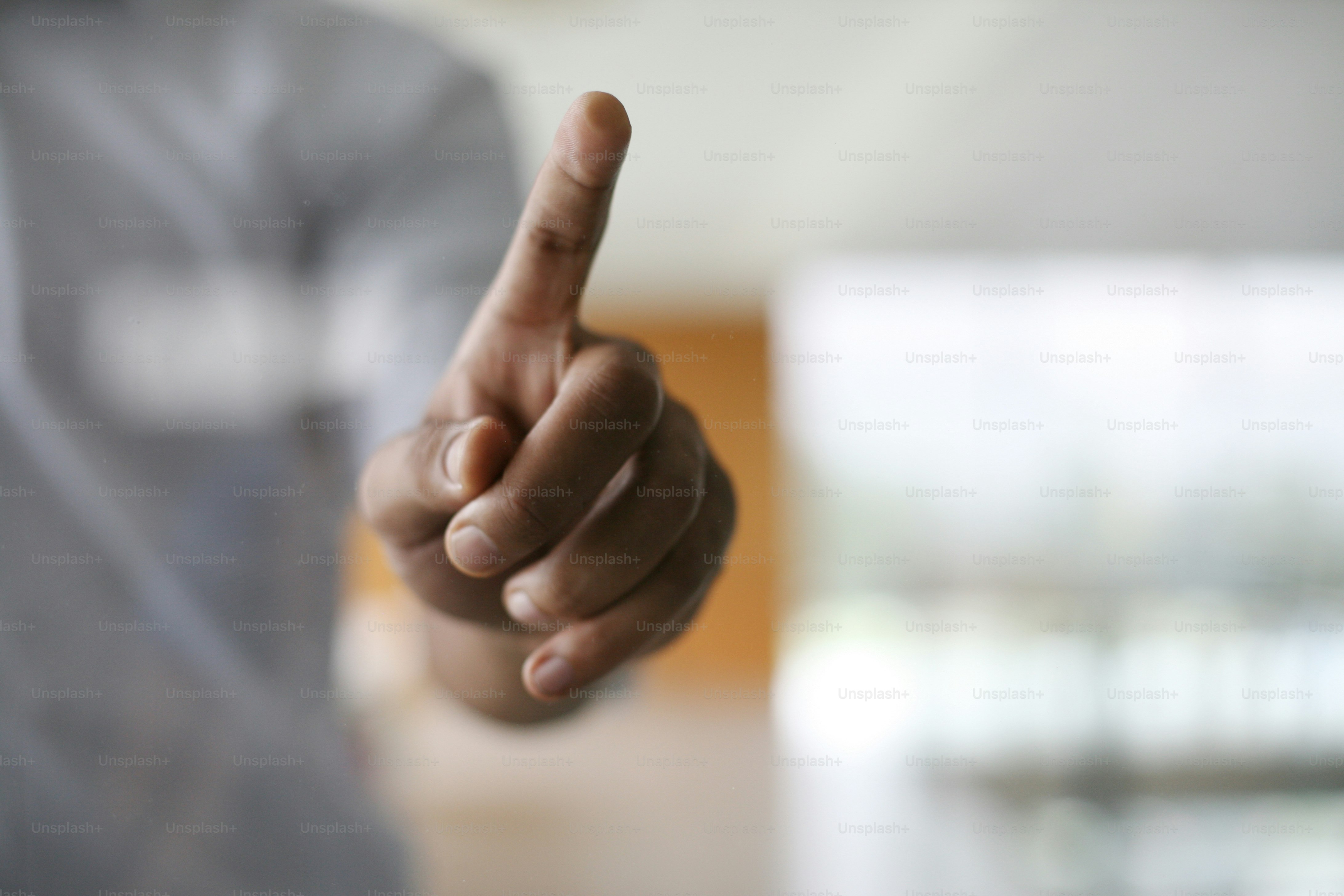 Close up. African business man holding finger on touch screen. photo ...