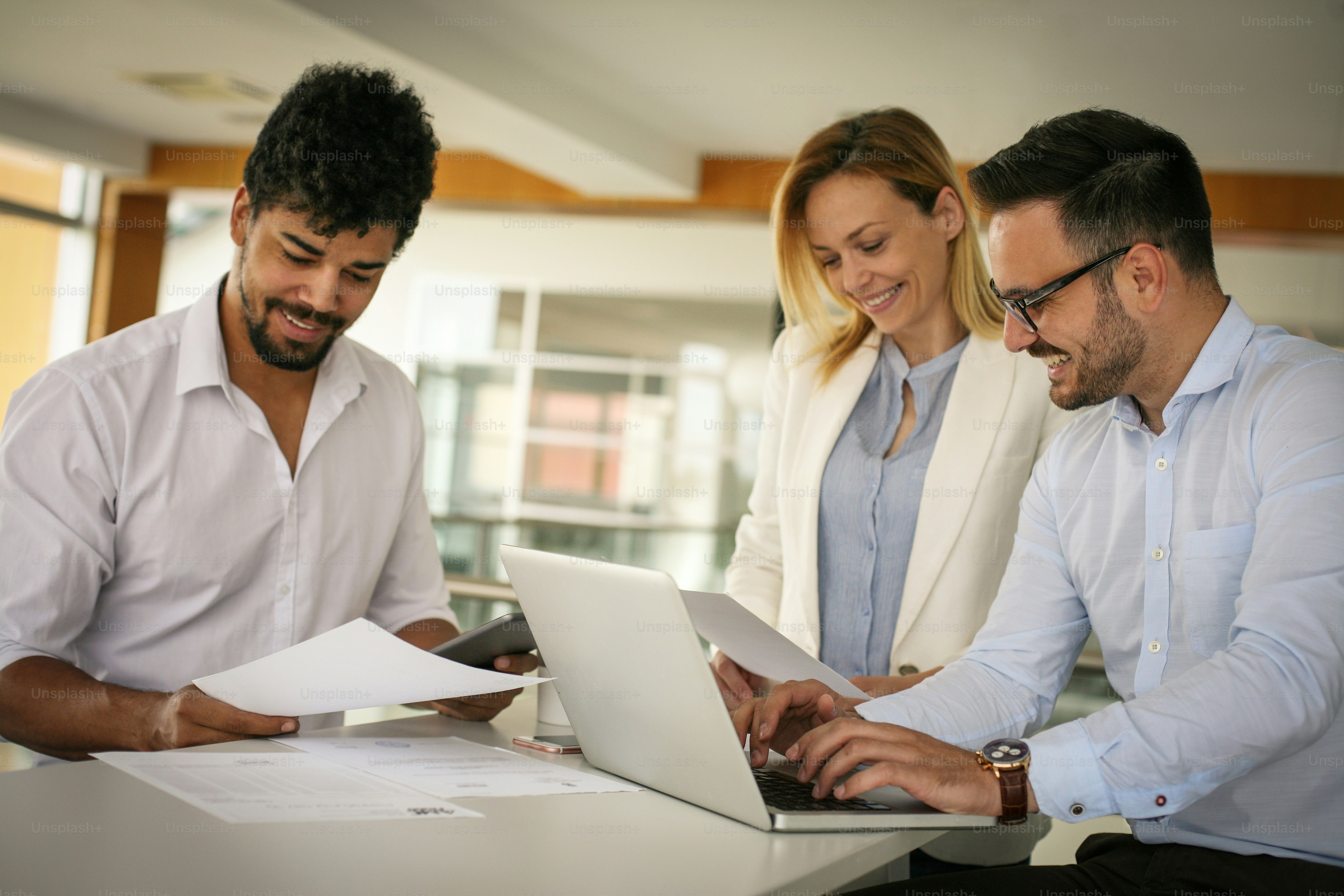 Business people using technology and checking document. Business people ...