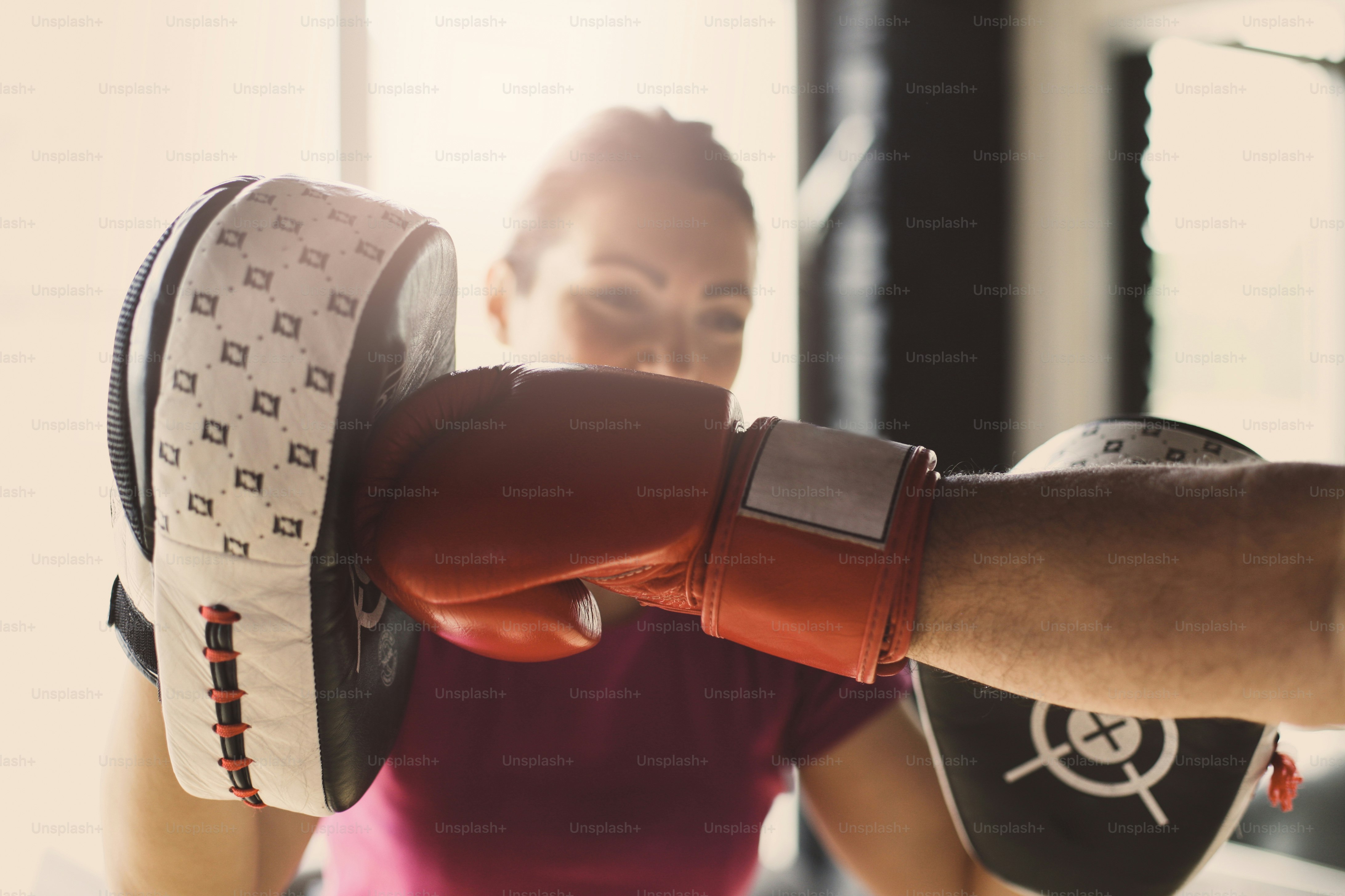 Older man boxing in gym. Senior man with personal trainer. photo ...