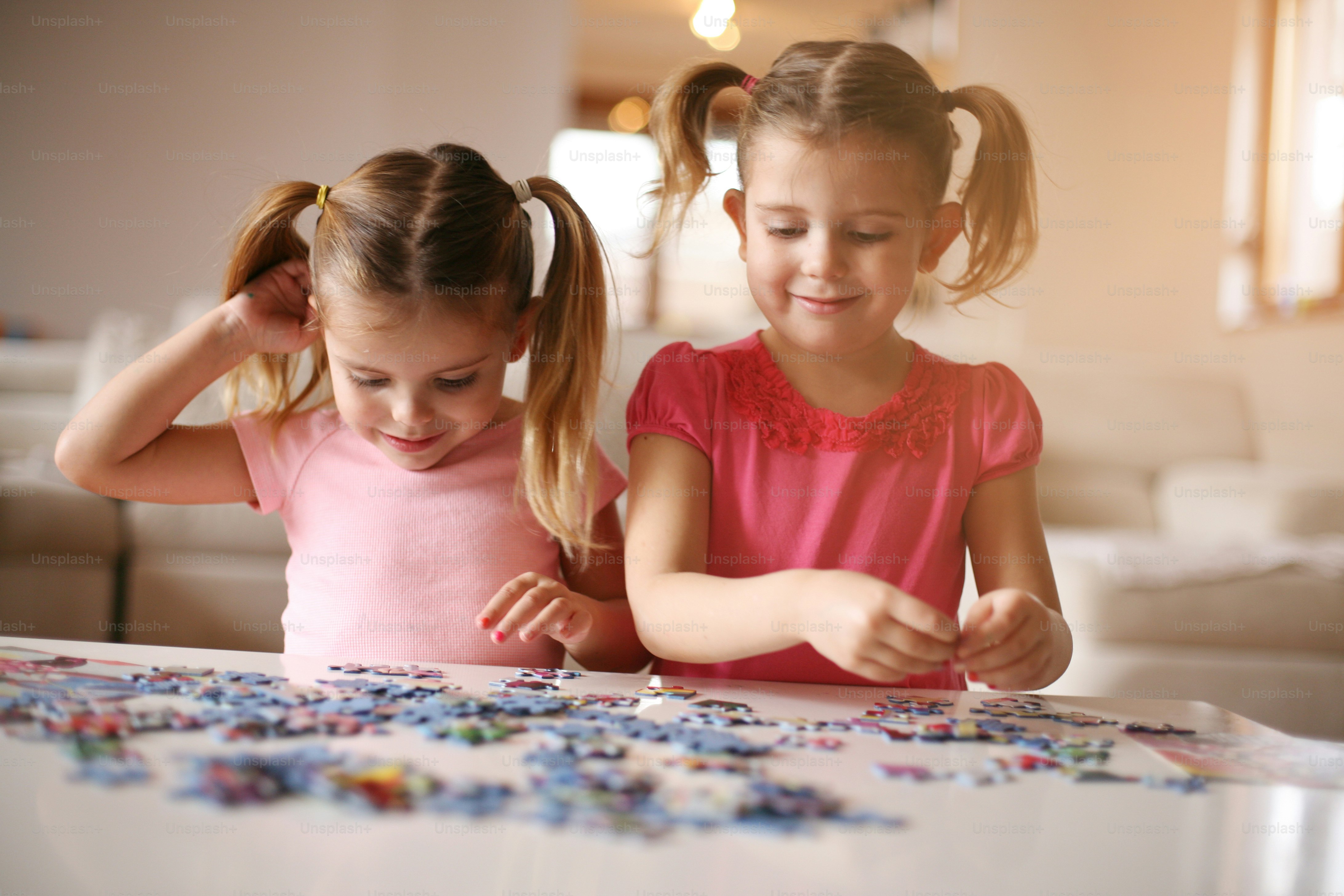 Girls playing at home. Girls playing with blocks at home. photo ...