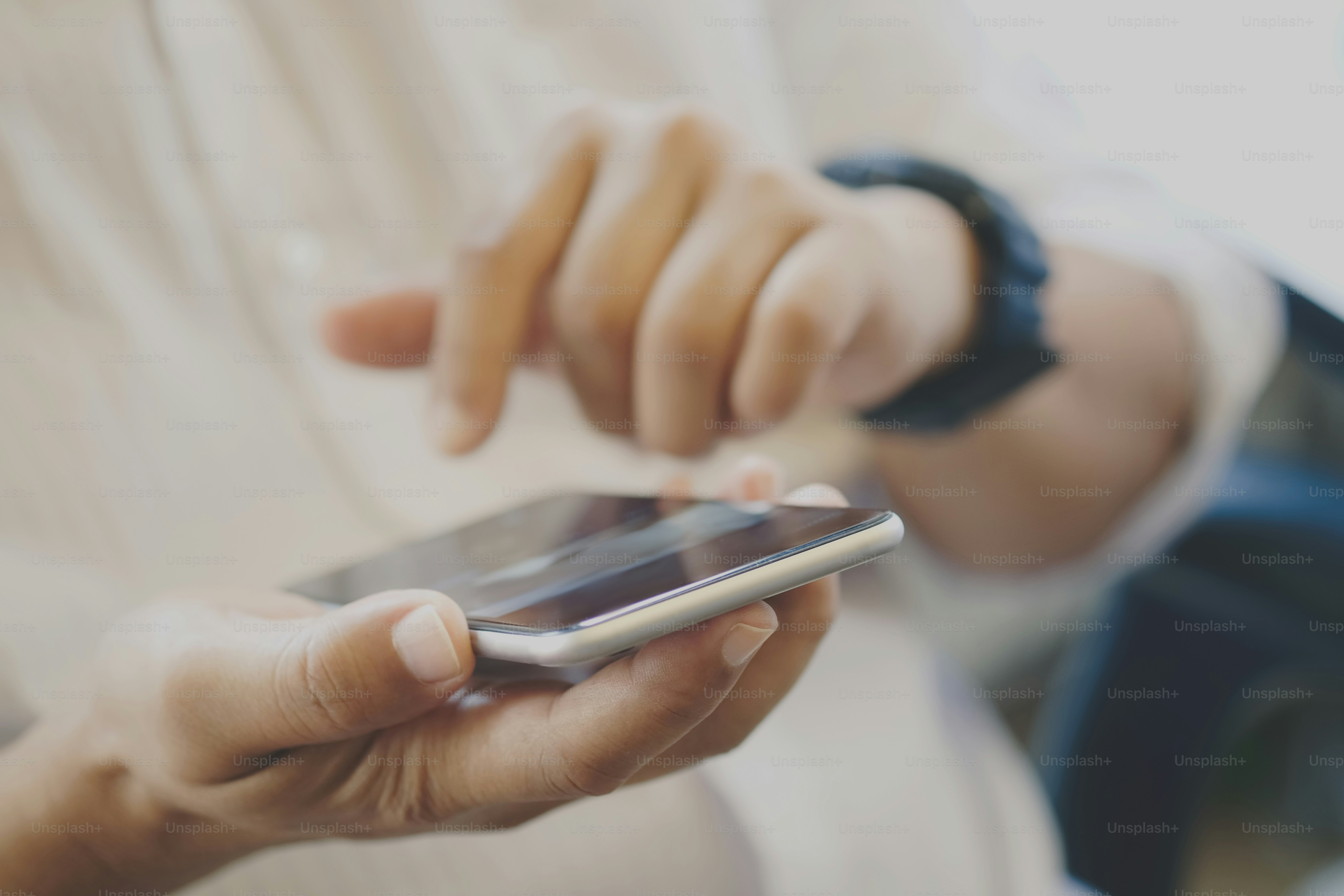 Close up of a man using mobile smartphone. photo – Working Image on ...