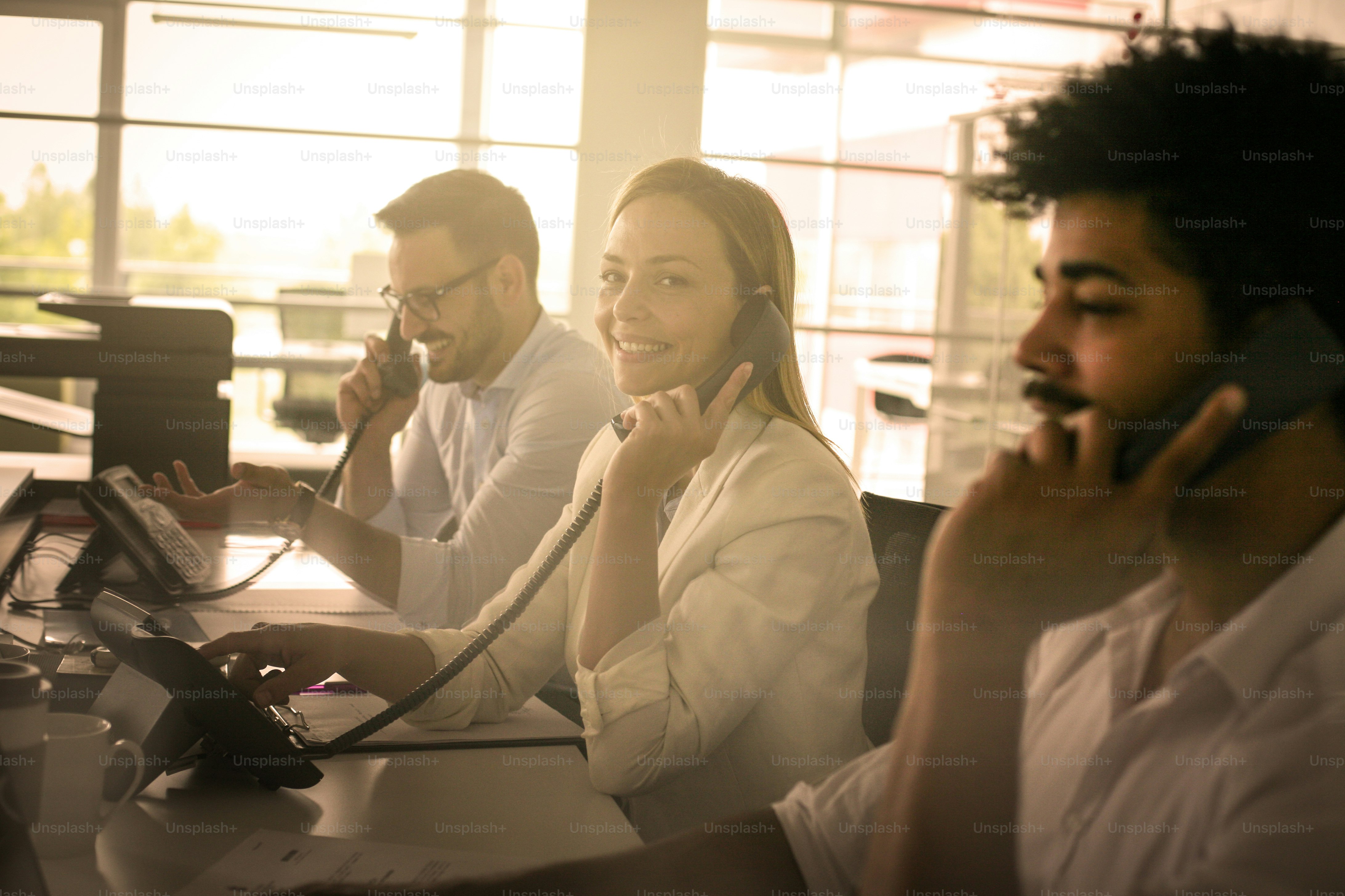 People in operations center talking on Landline phone. Operators in the ...