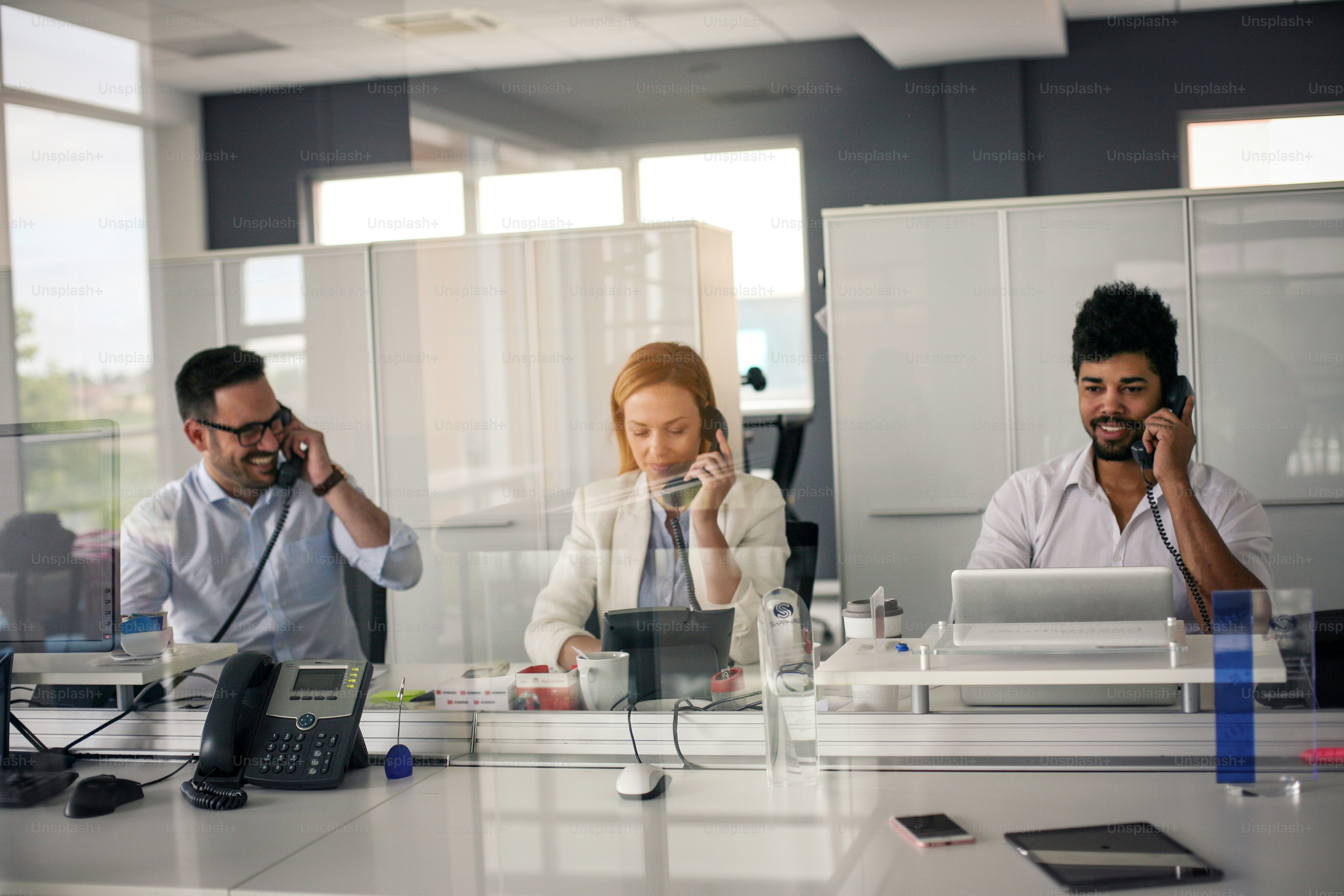 People in operations center talking on Landline phone. Operators in the ...