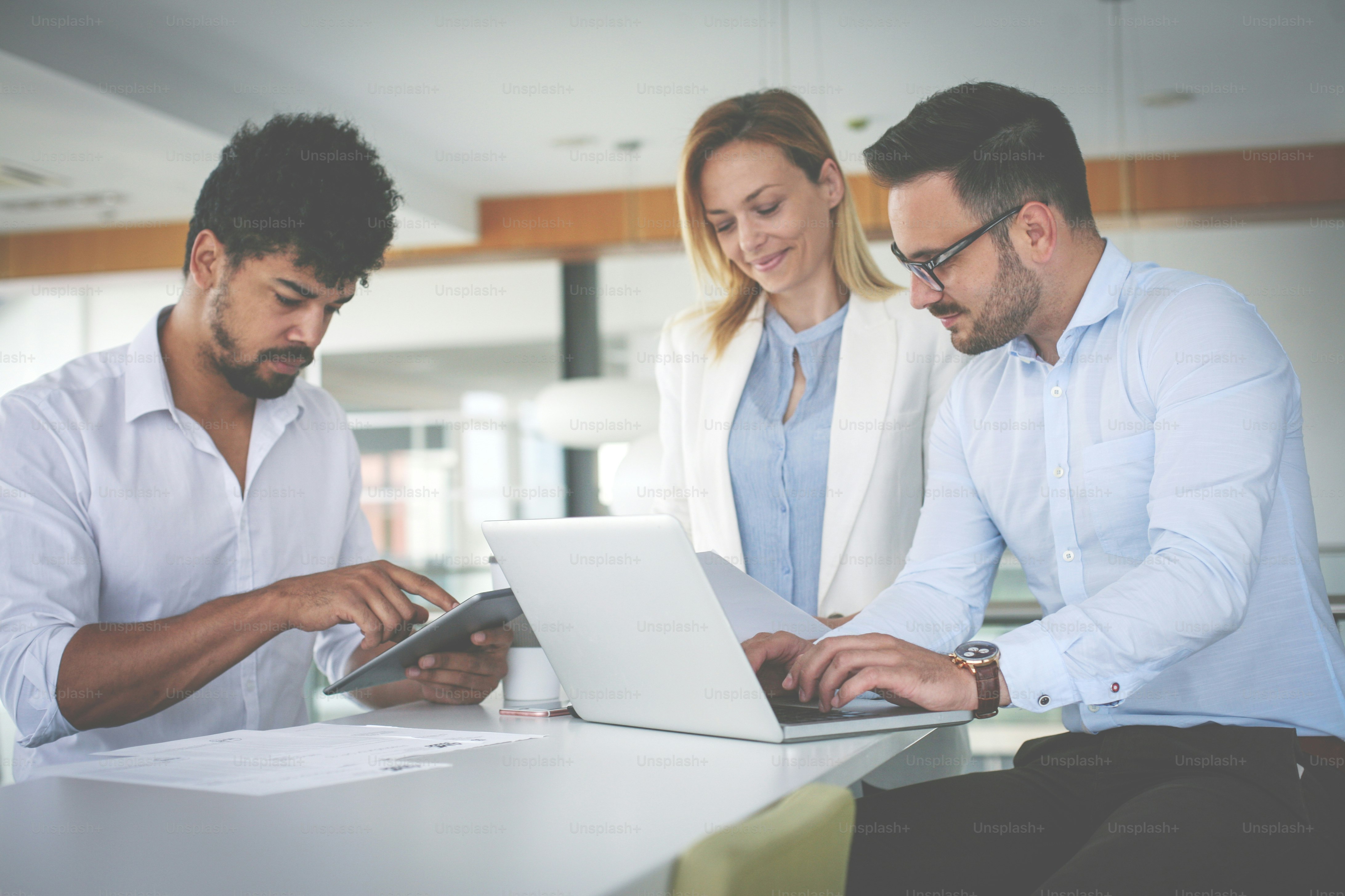 Business people using technology and checking document. Business people ...