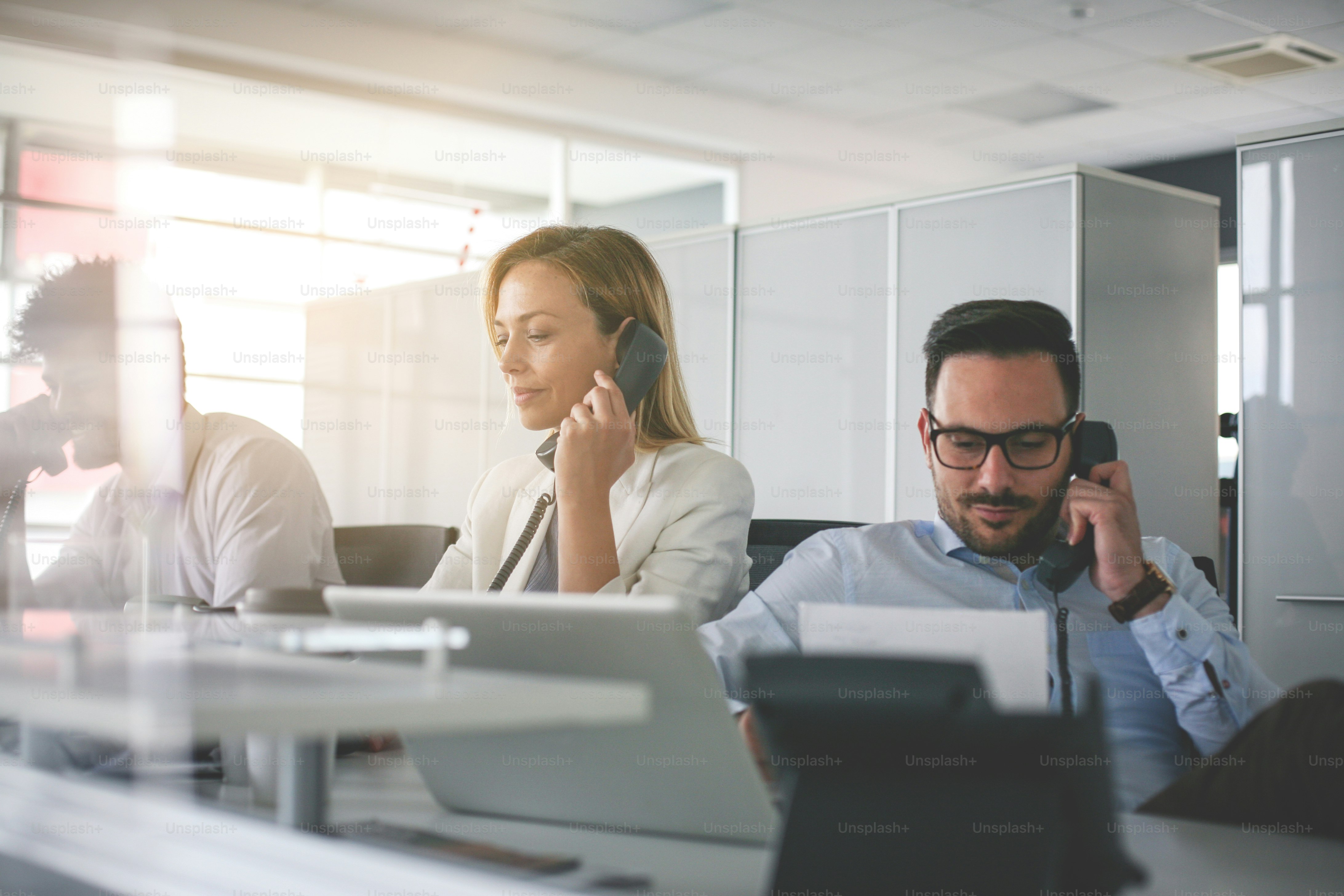 People in operations center talking on Landline phone. Operators in the ...