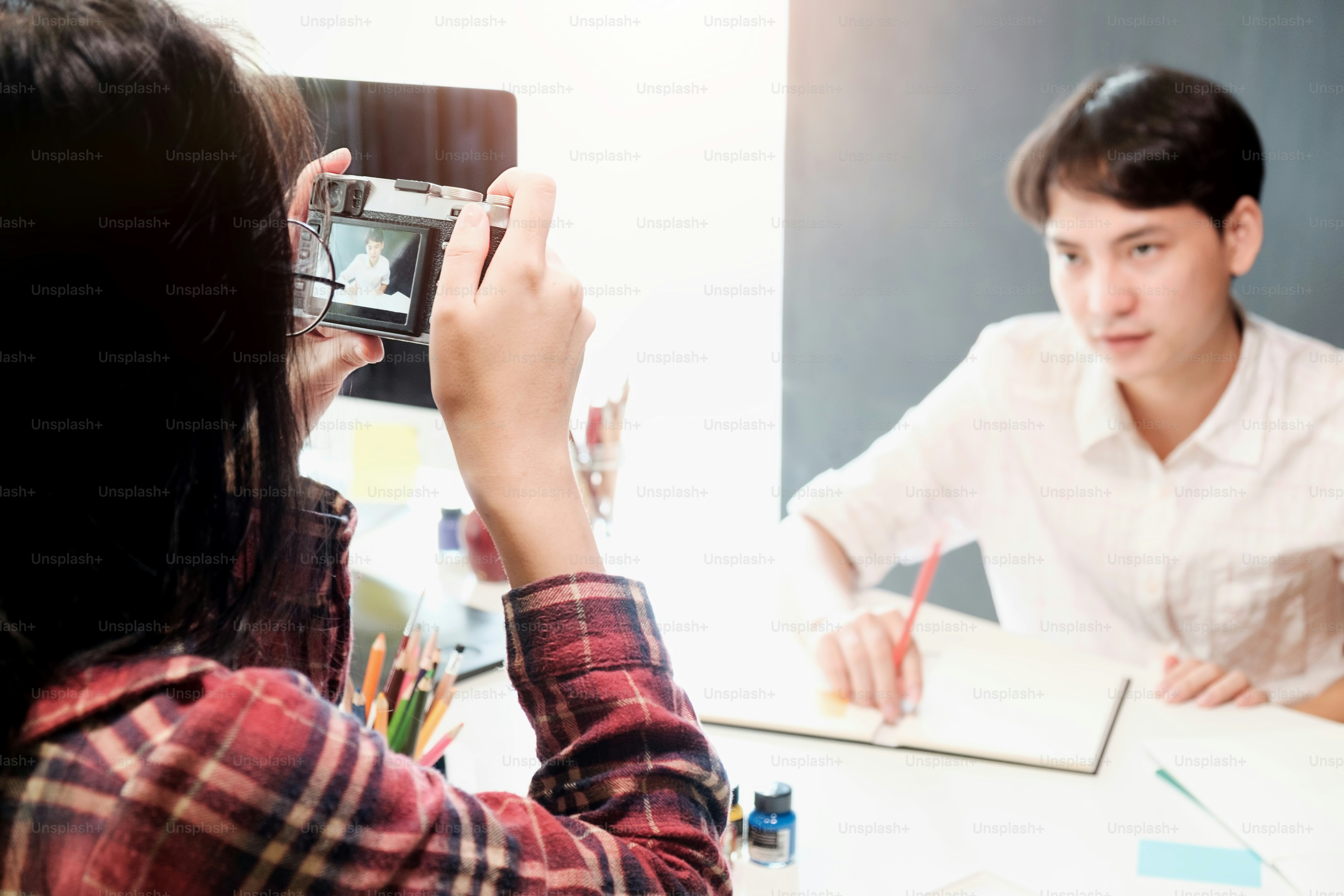 Creative people use camera for interview job in creative office with ...