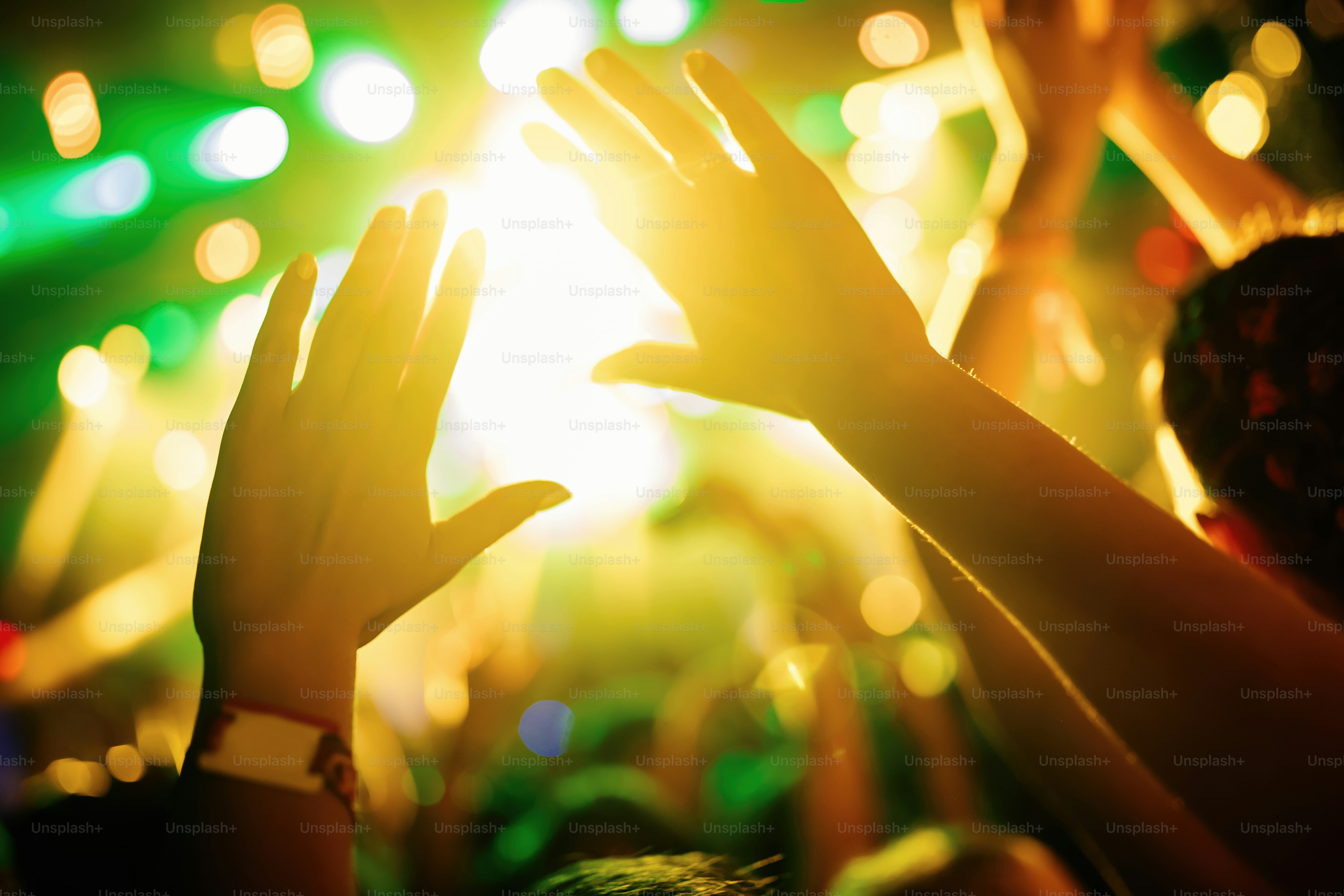 Portrait of happy crowd enjoying and dancing at music festival photo ...