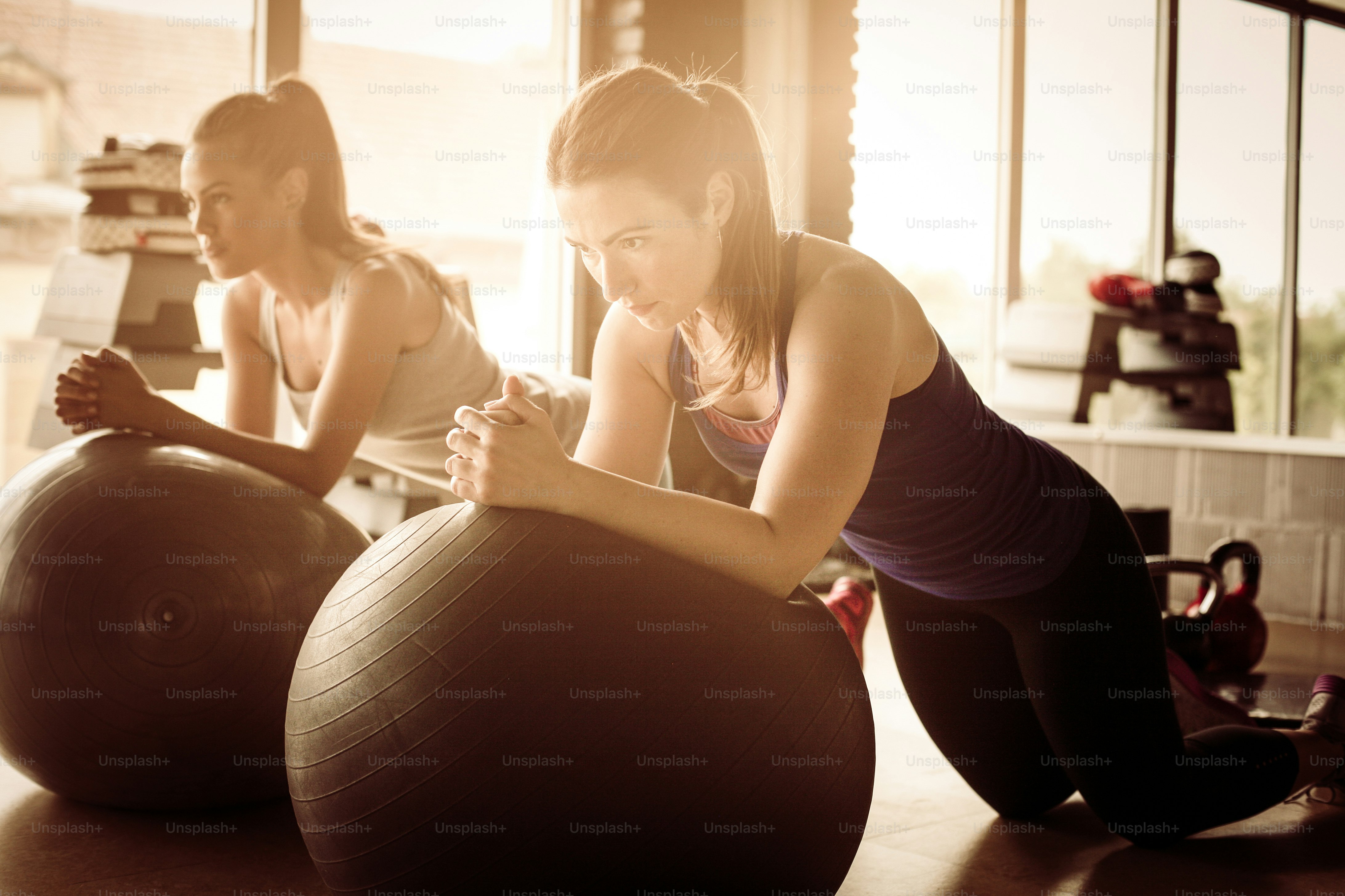 Young woman working exercise on Pilates ball. photo – Sphere Image on ...