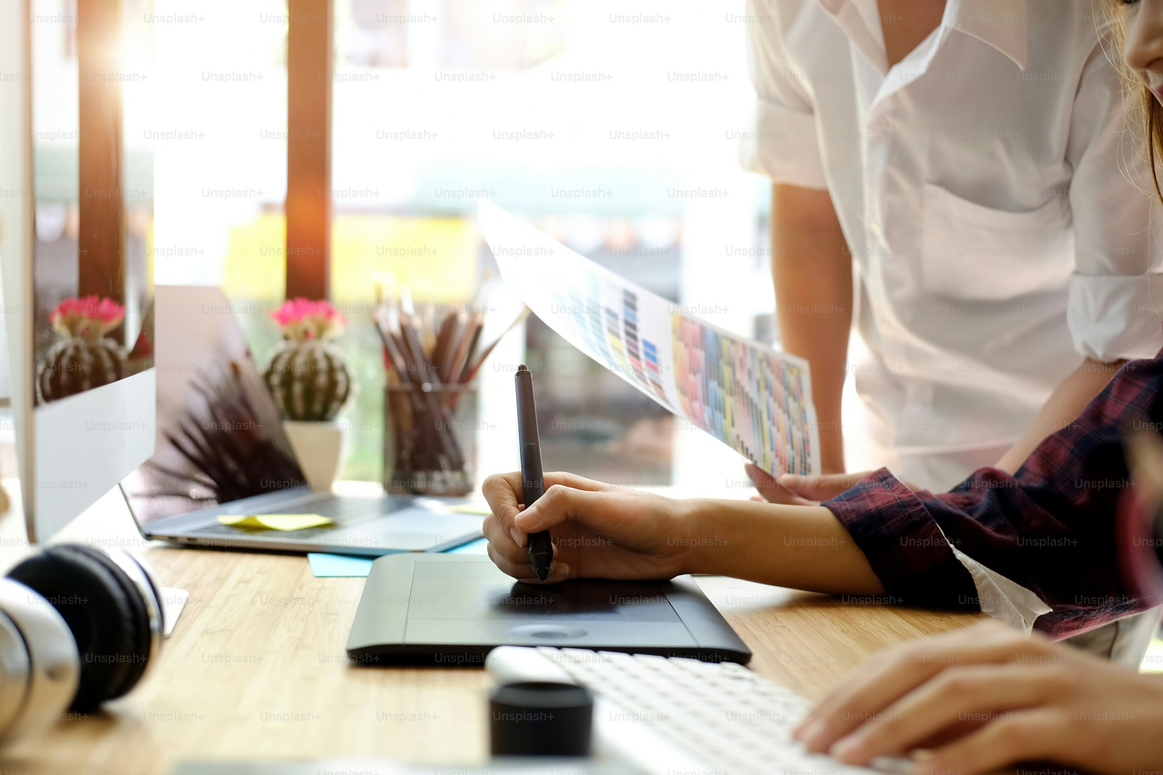 Coworkers Teamworking Process. Team designer using graphics tablet ...