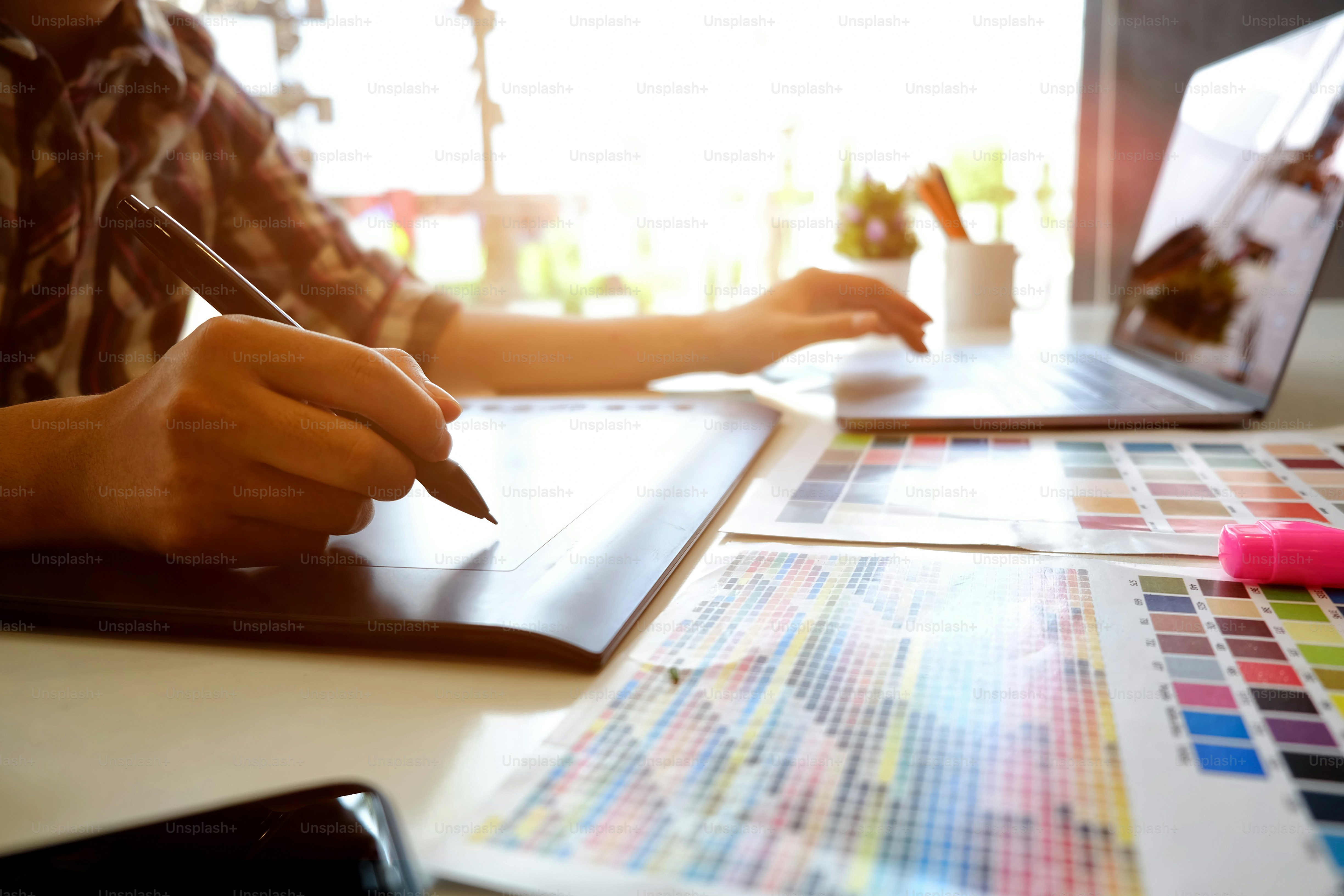 Graphic designer at work. Graphic designer using digital tablet and ...