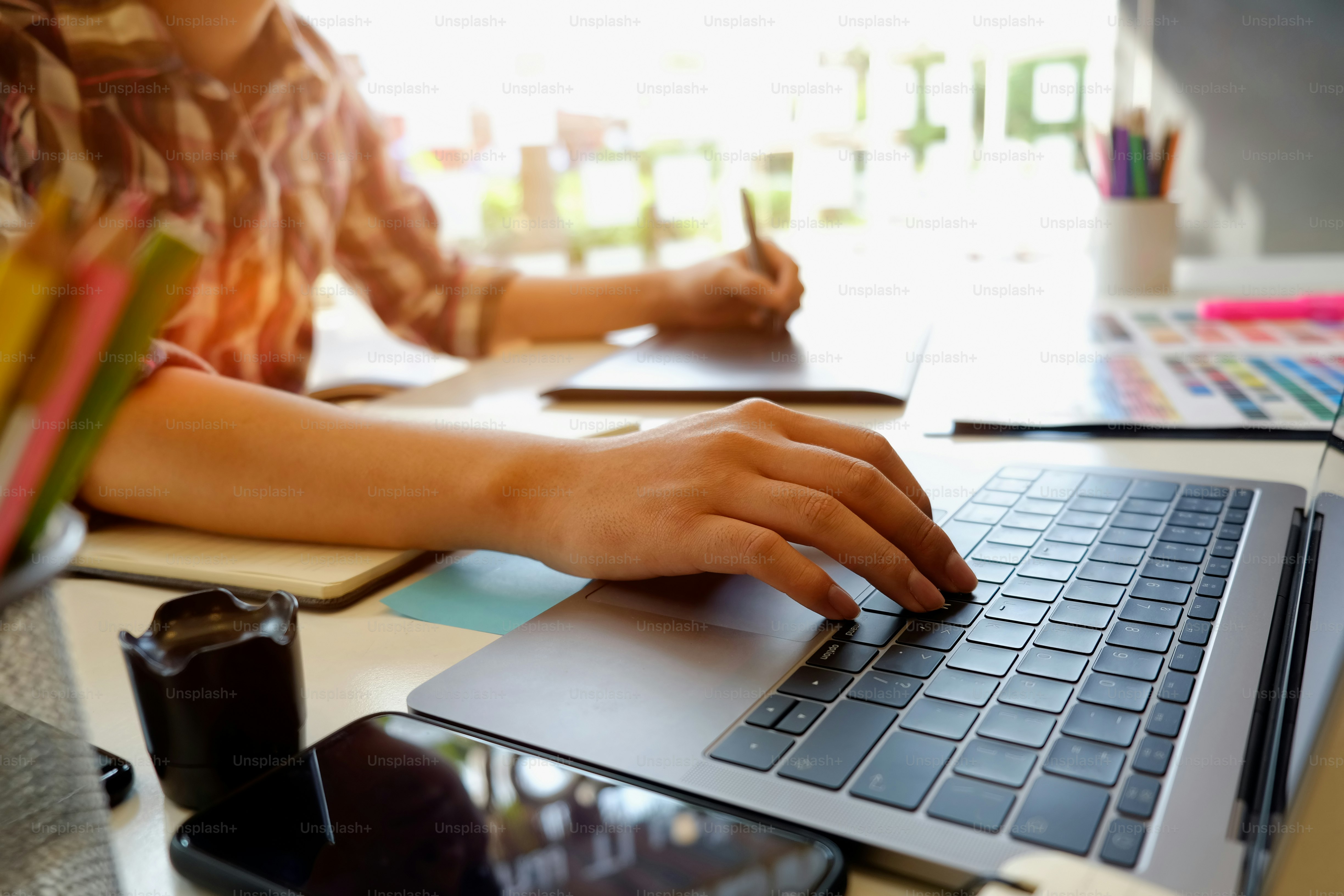 Graphic designer at work. Graphic designer using digital tablet and ...