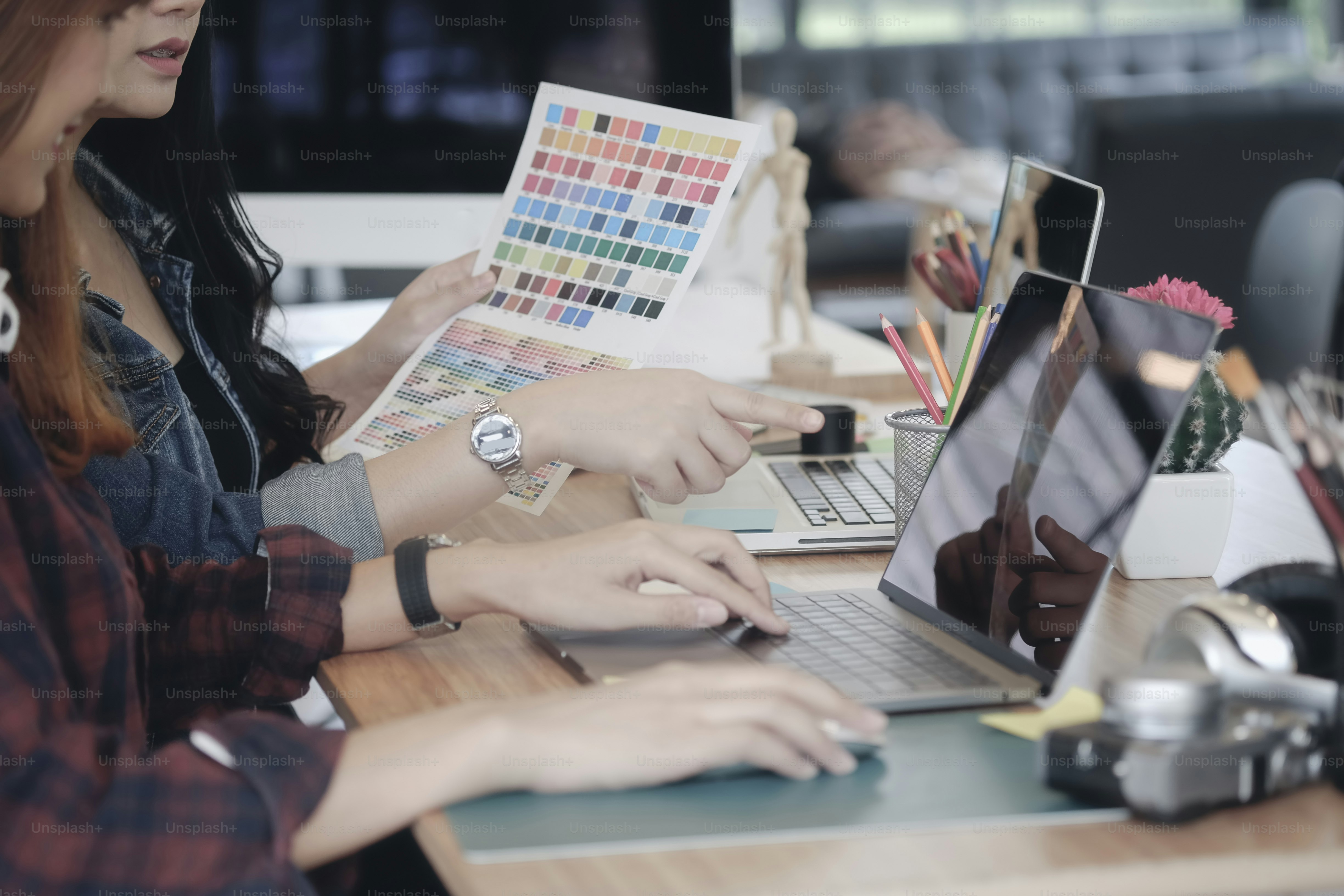 Teamwork,brainstorming concept. Creative designer at the workshop. Young creative design team ...