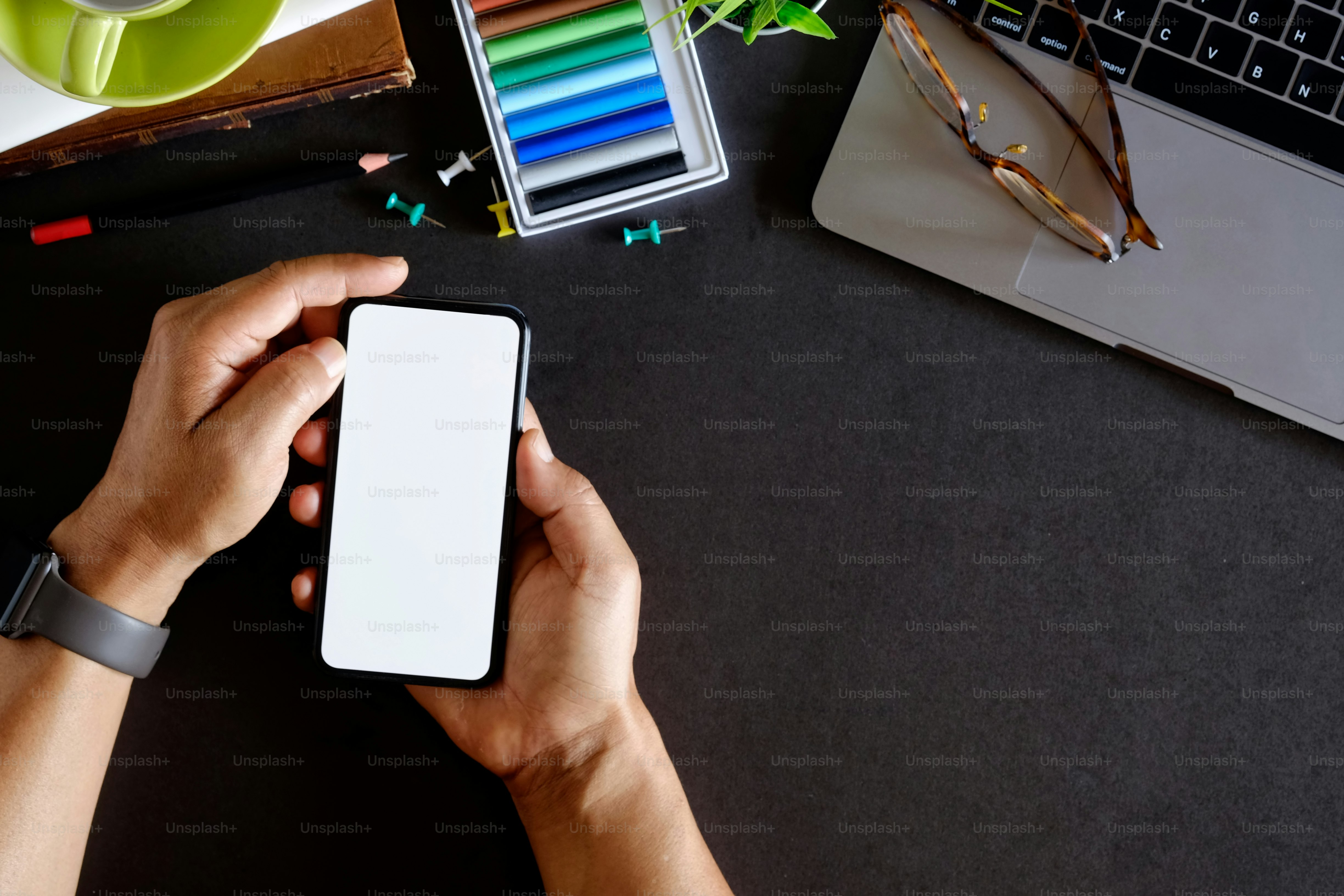 Cropped shot top view of businessman hands using smartphone mockup with ...