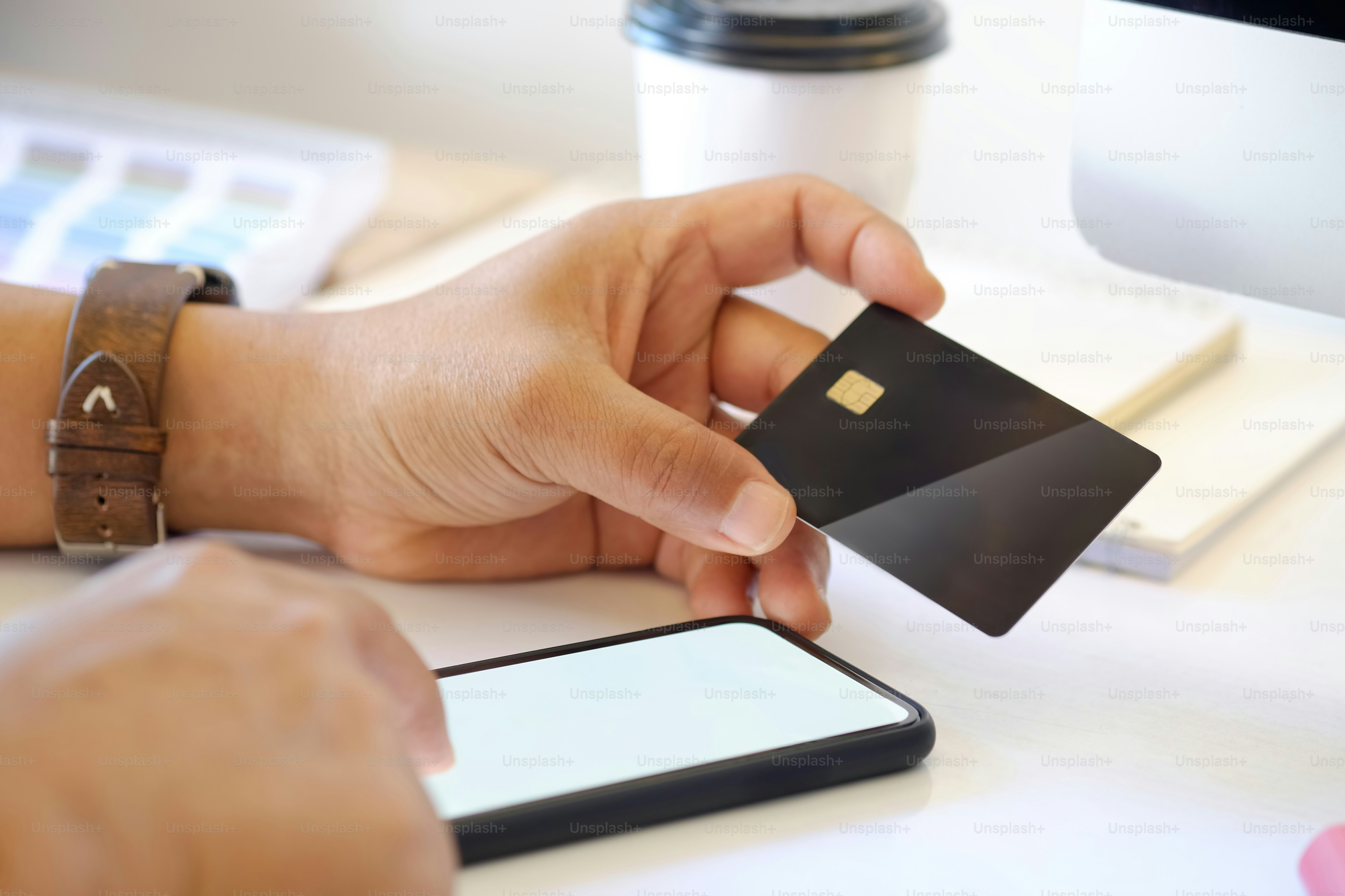 Online payment Concept. Man using credit card with mobile phone and ...