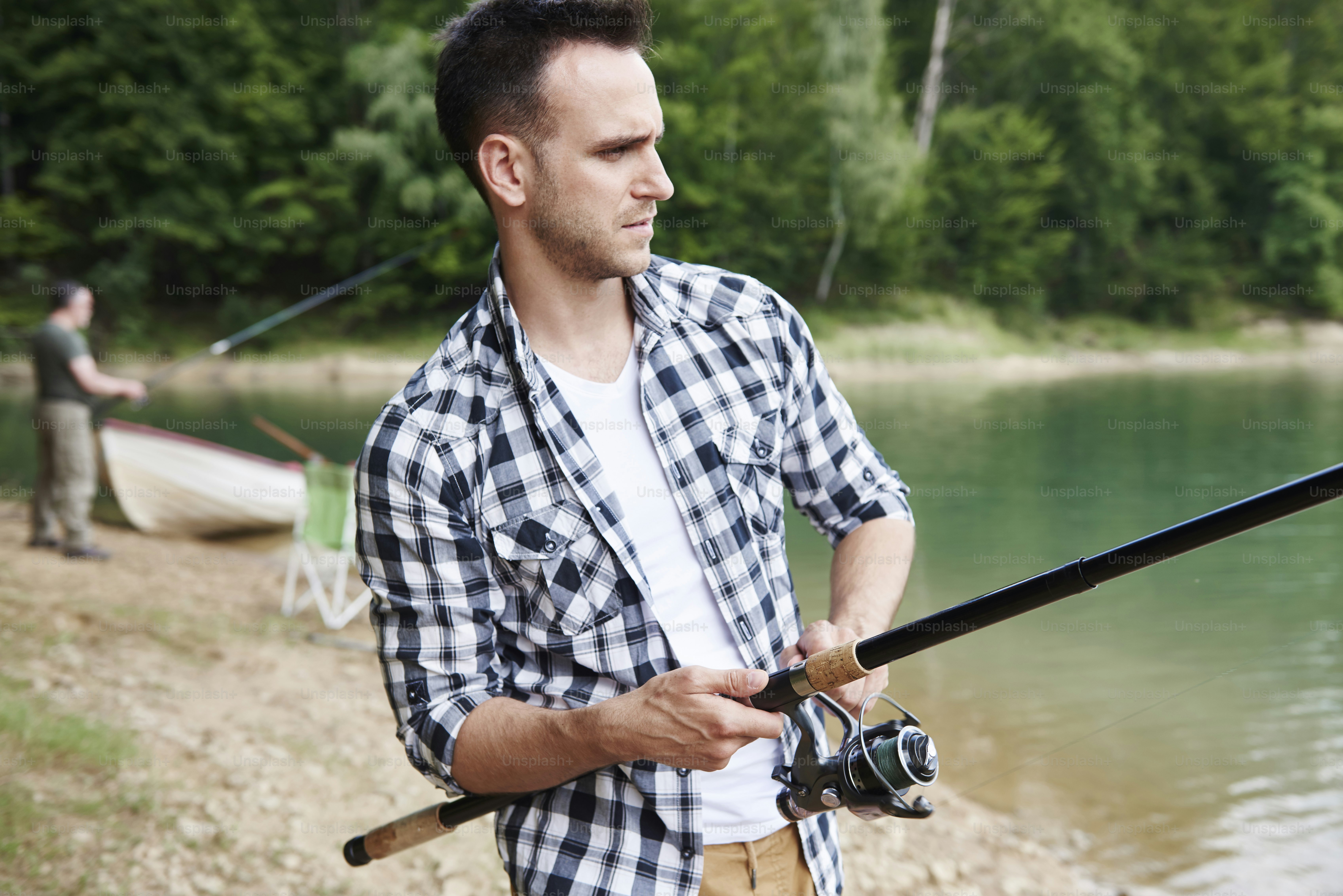 Serious men catching fish by a lake photo – Fishing Image on Unsplash