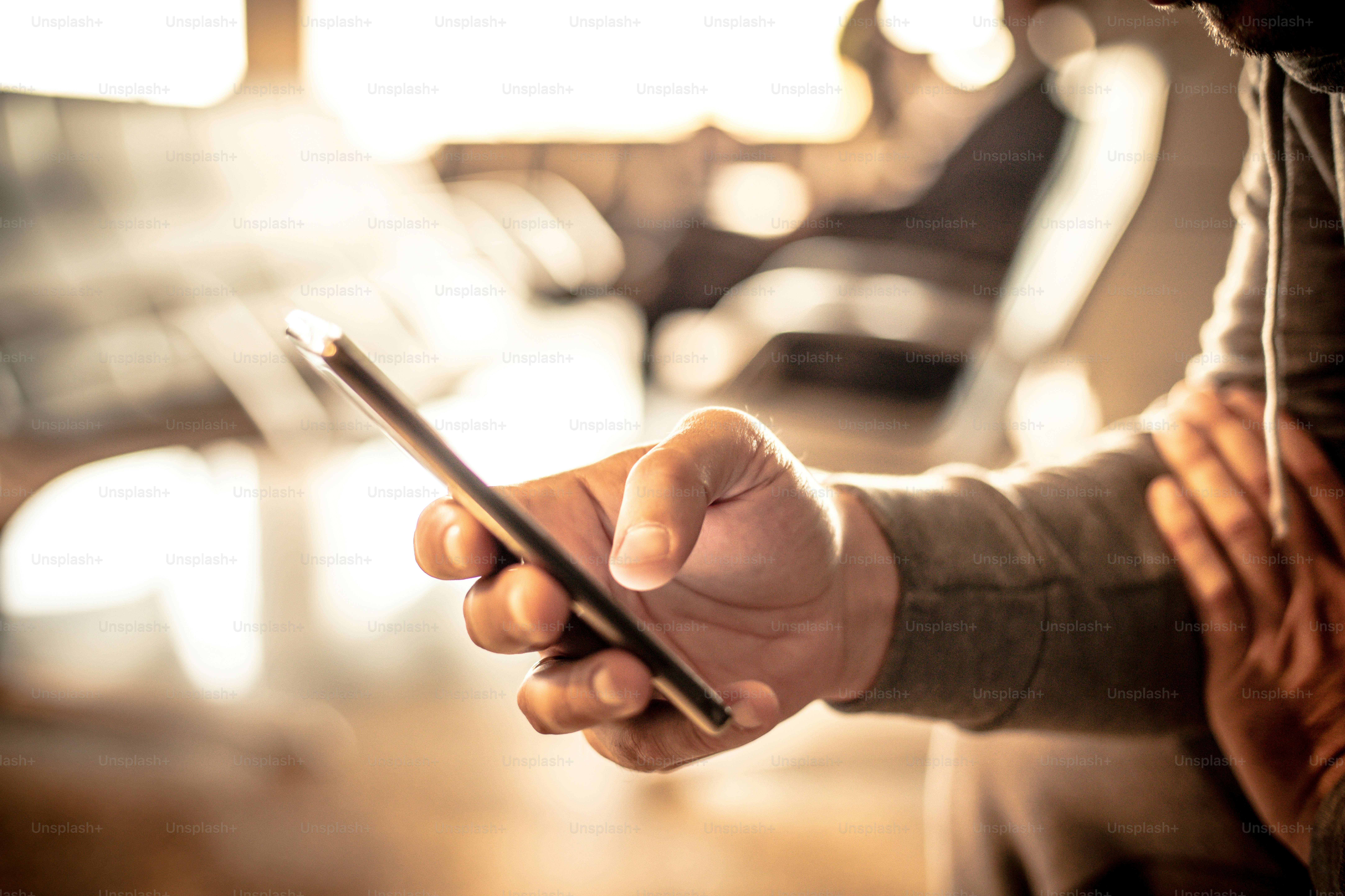 Men using mobile phone at airport. Close up. photo – Serbia Image on ...