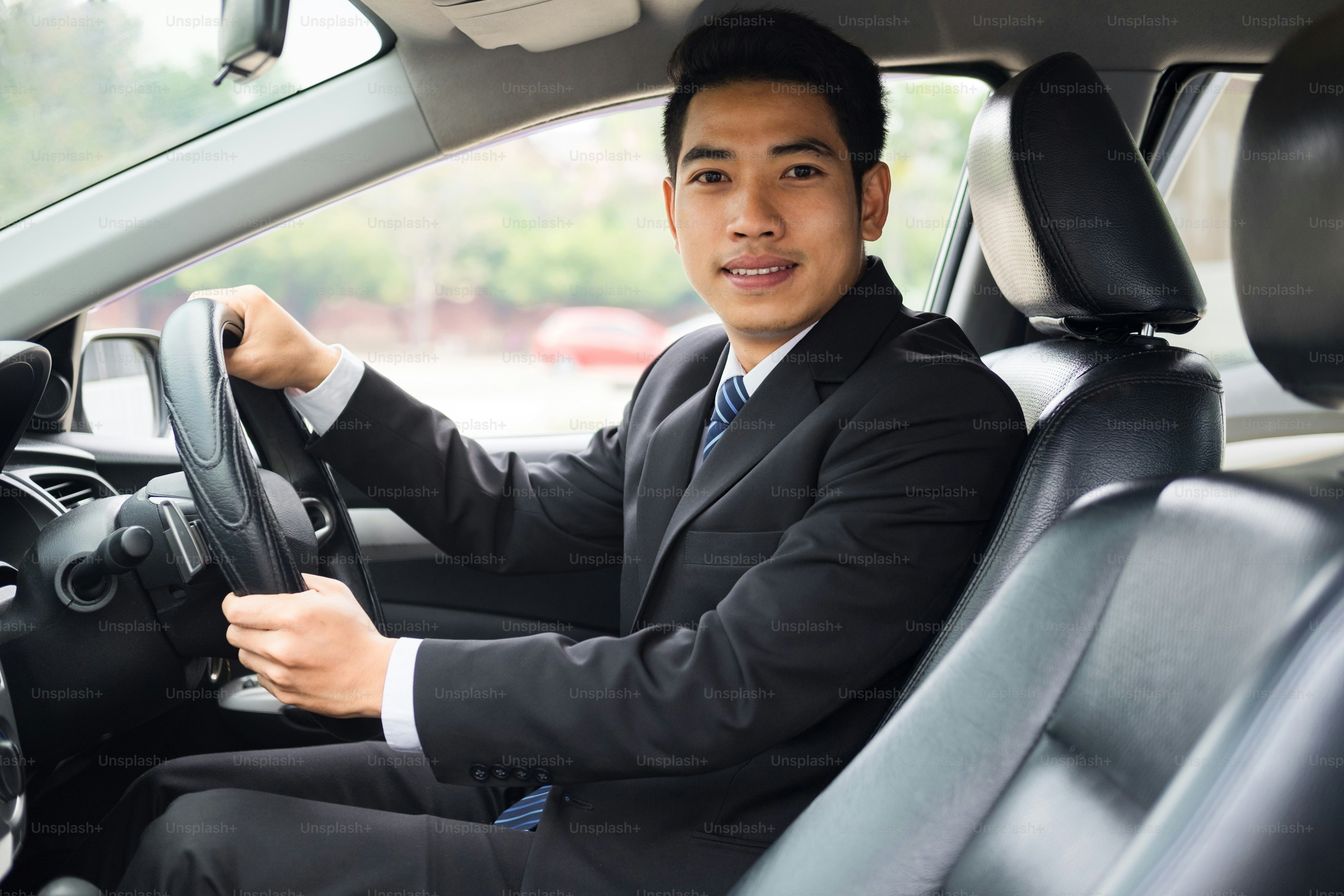 Business driver service for VIP customer. Businessman drive a car ...