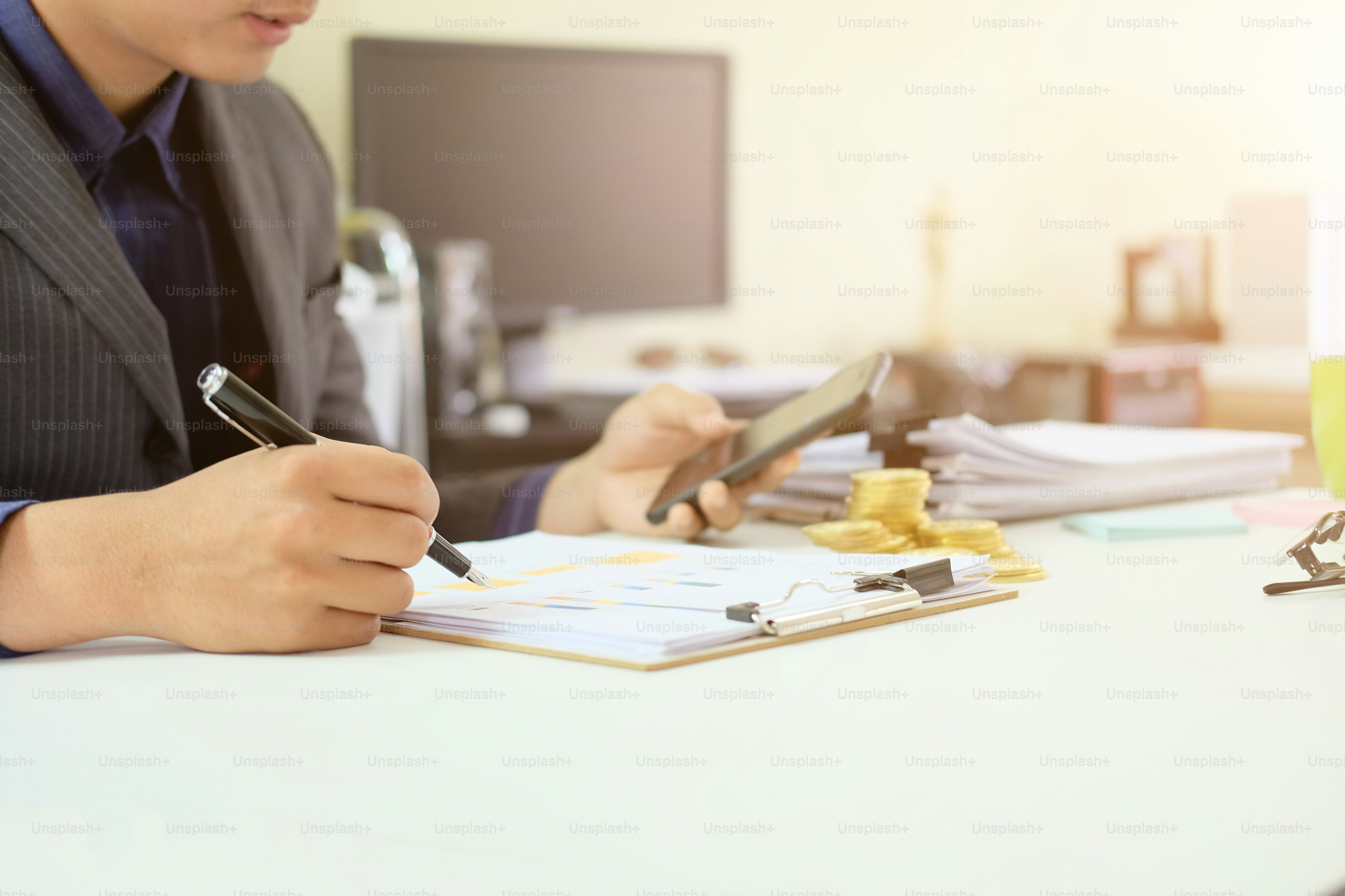 Businessman working on paper documents finance investment concept ...