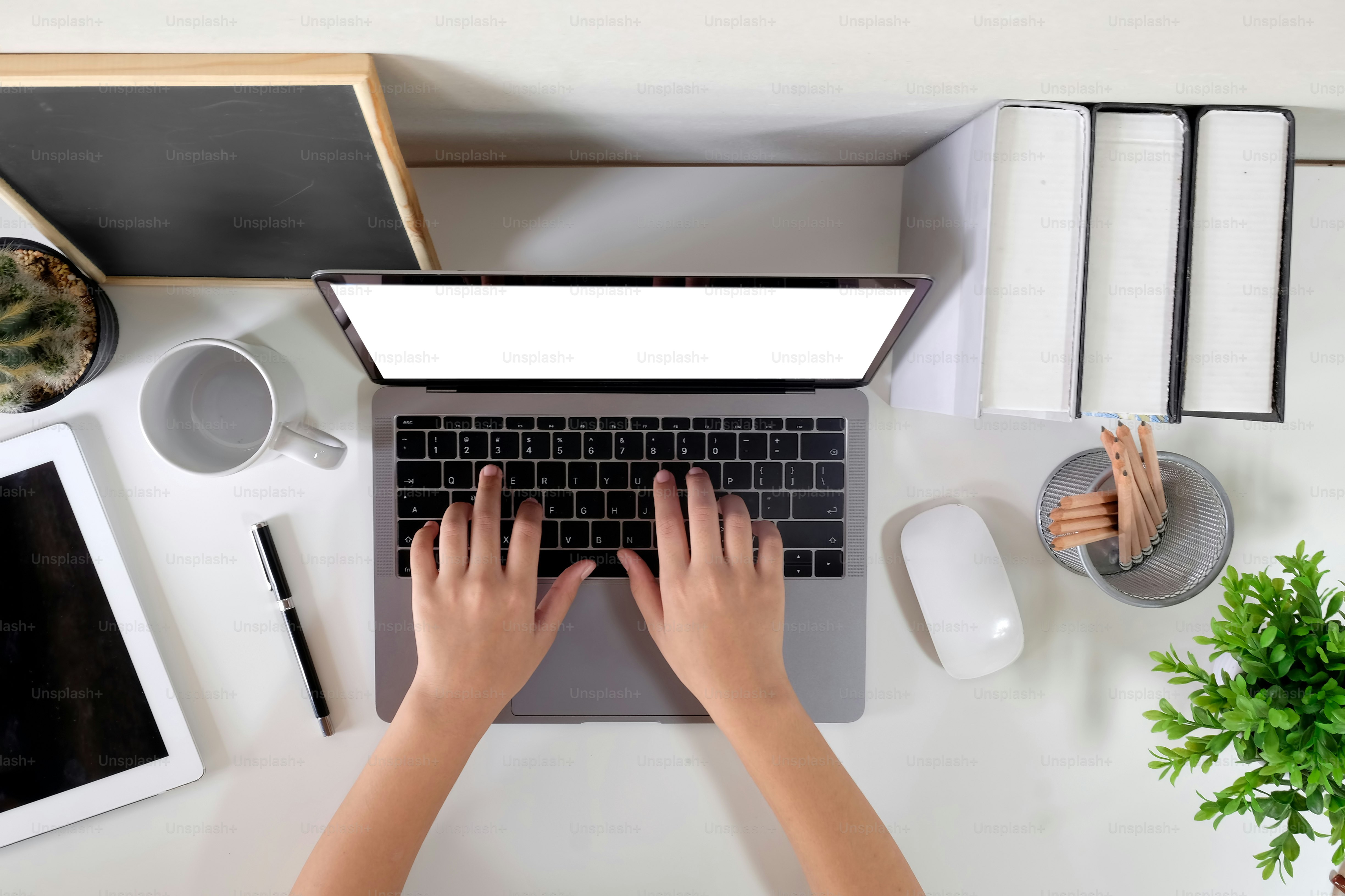 Top view workspace female hands typing laptop on wooden desk in office ...