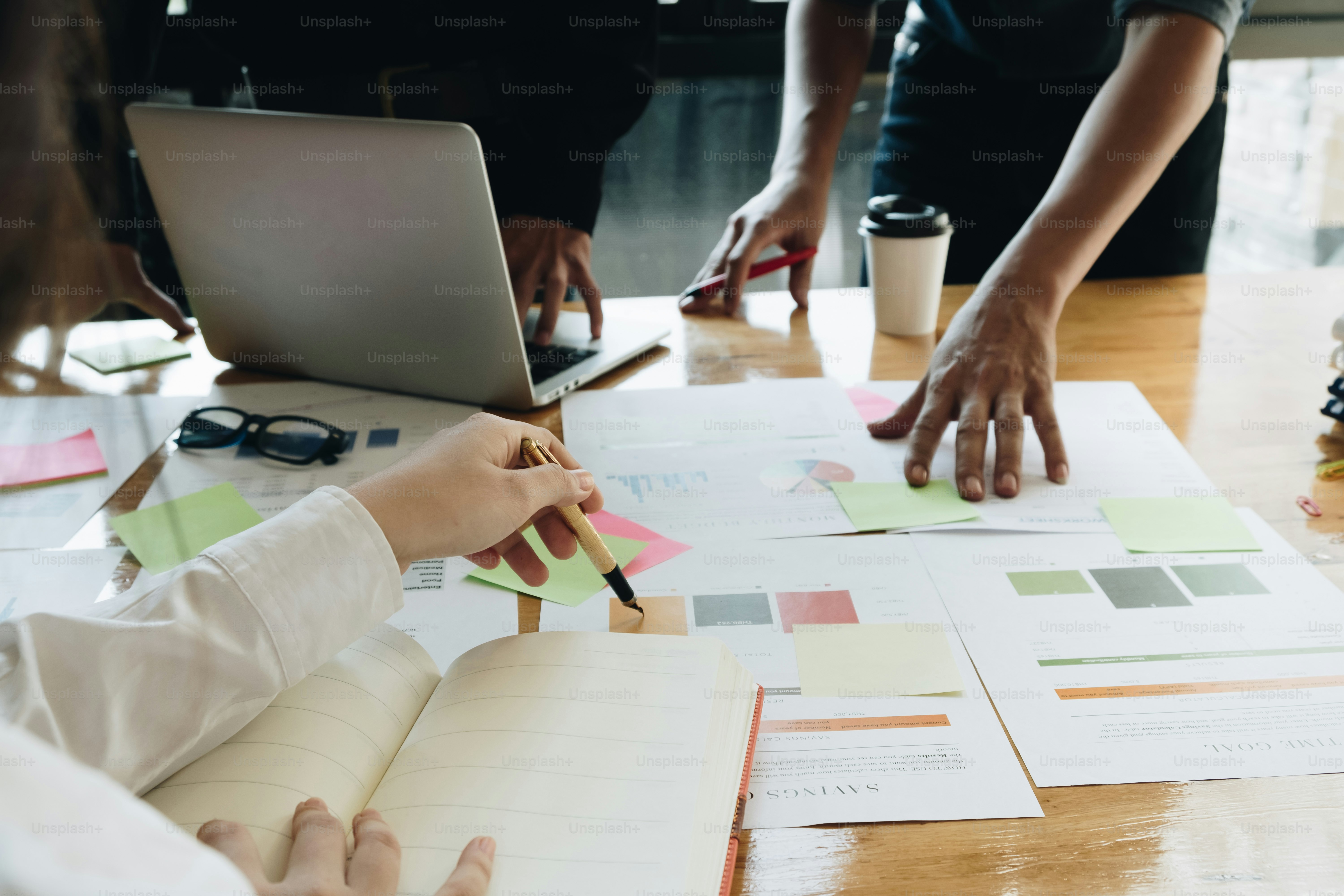 The female secretary holding notebook to write a note at the meeting ...