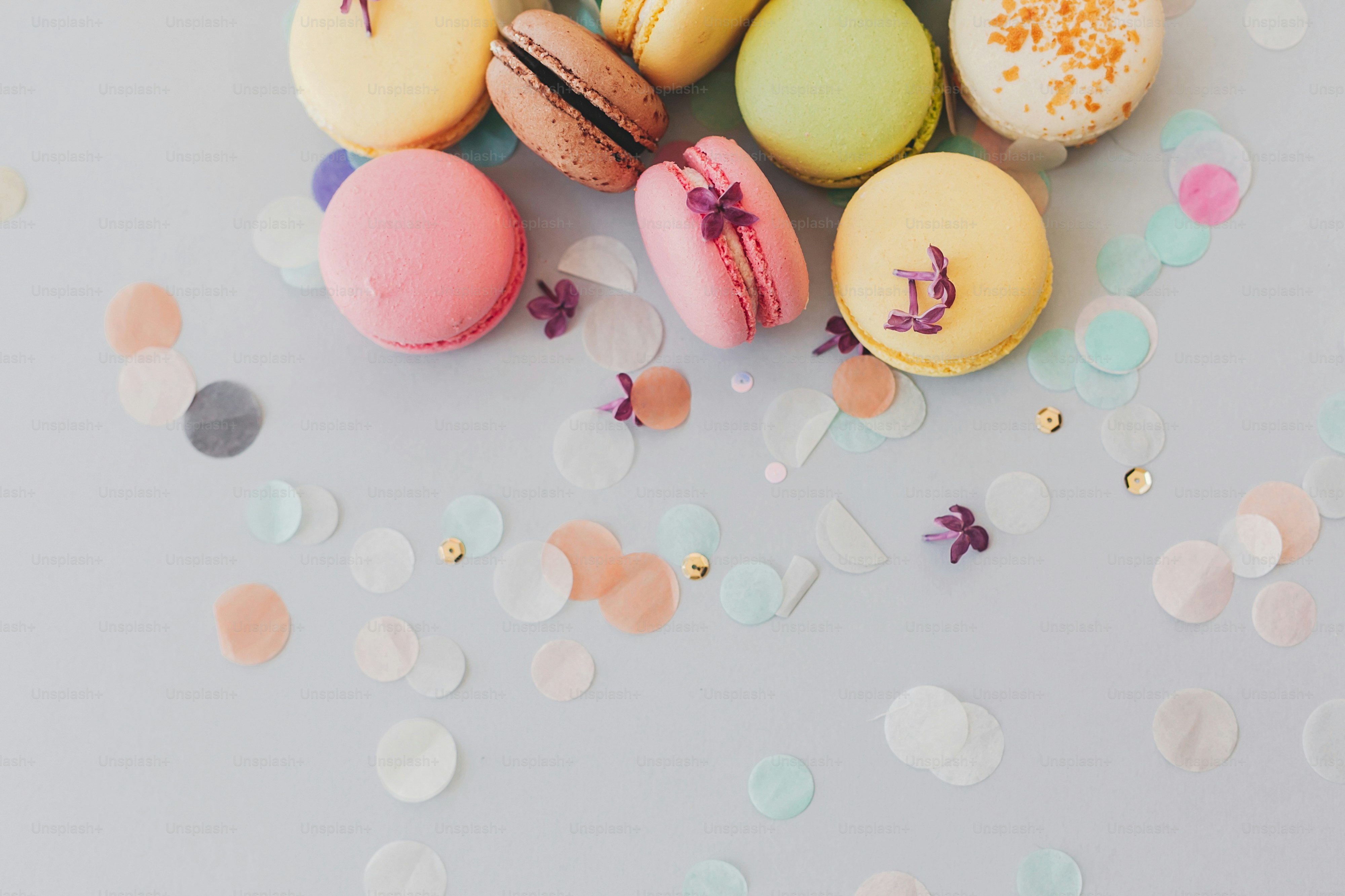 Delicious colorful macaroons on trendy pastel gray paper with lilac ...