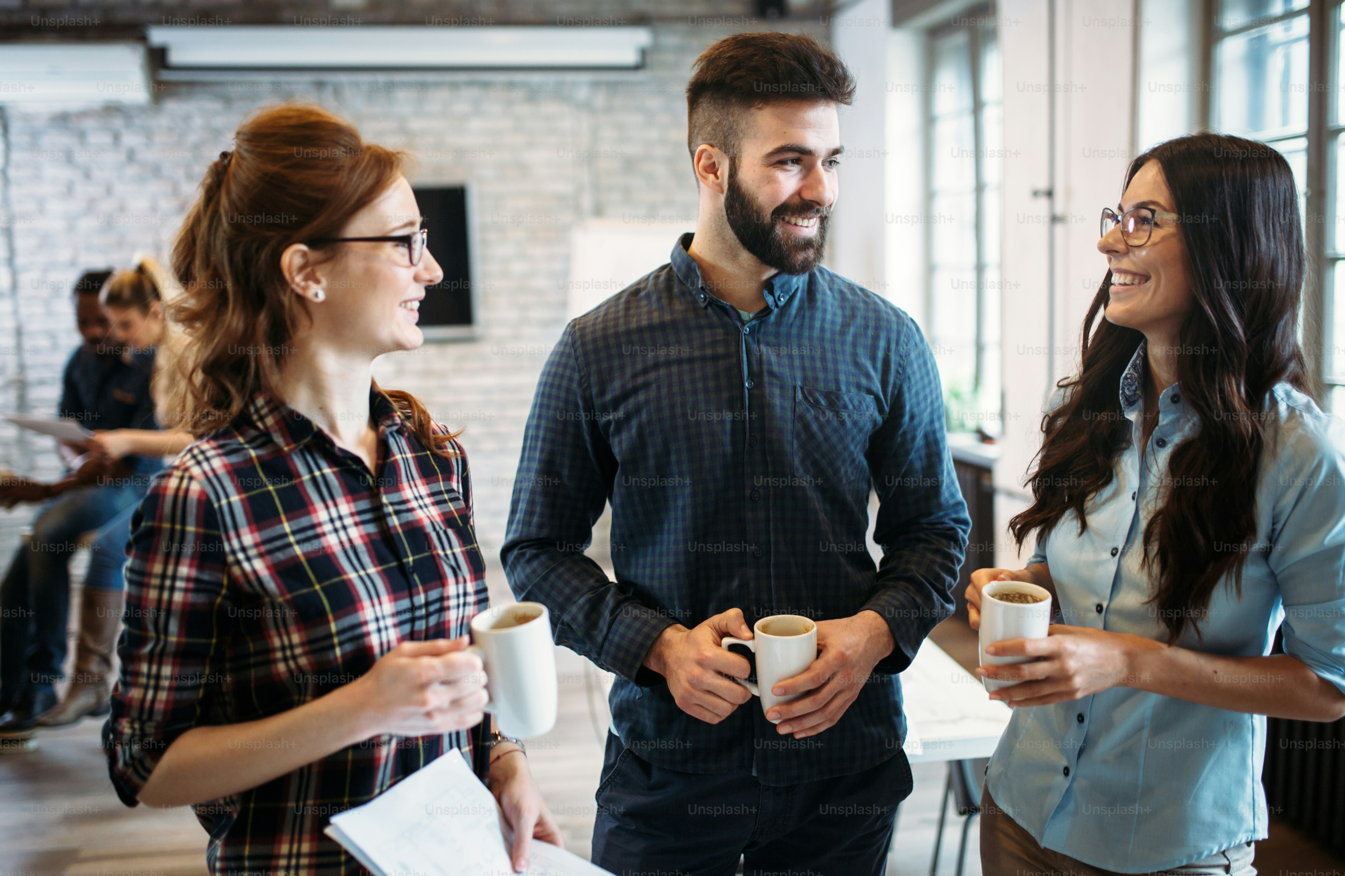 Portrait of young architects having discussion in office photo – Serbia ...