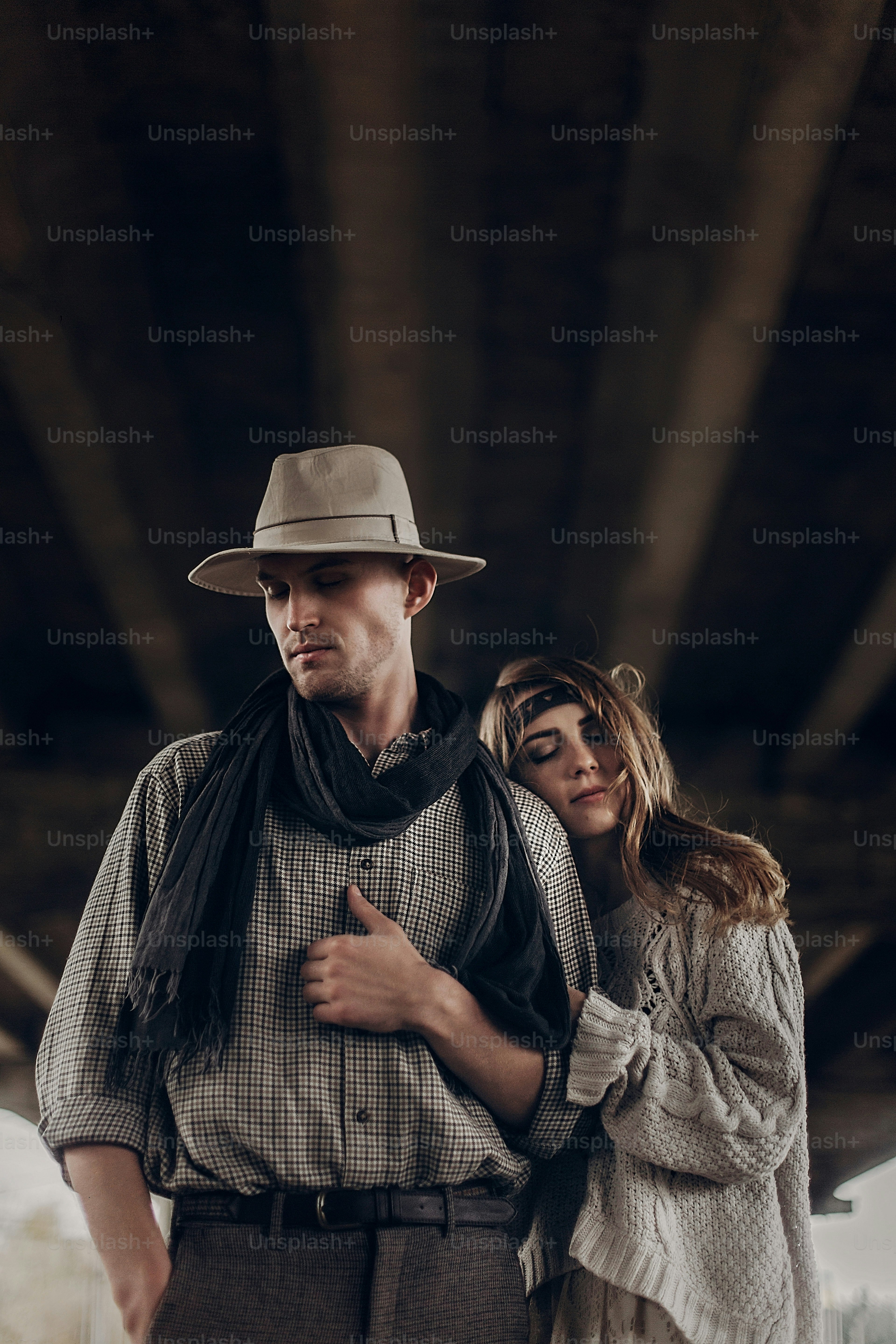 Romantic gypsy woman in stylish boho clothes and white dress hugging ...