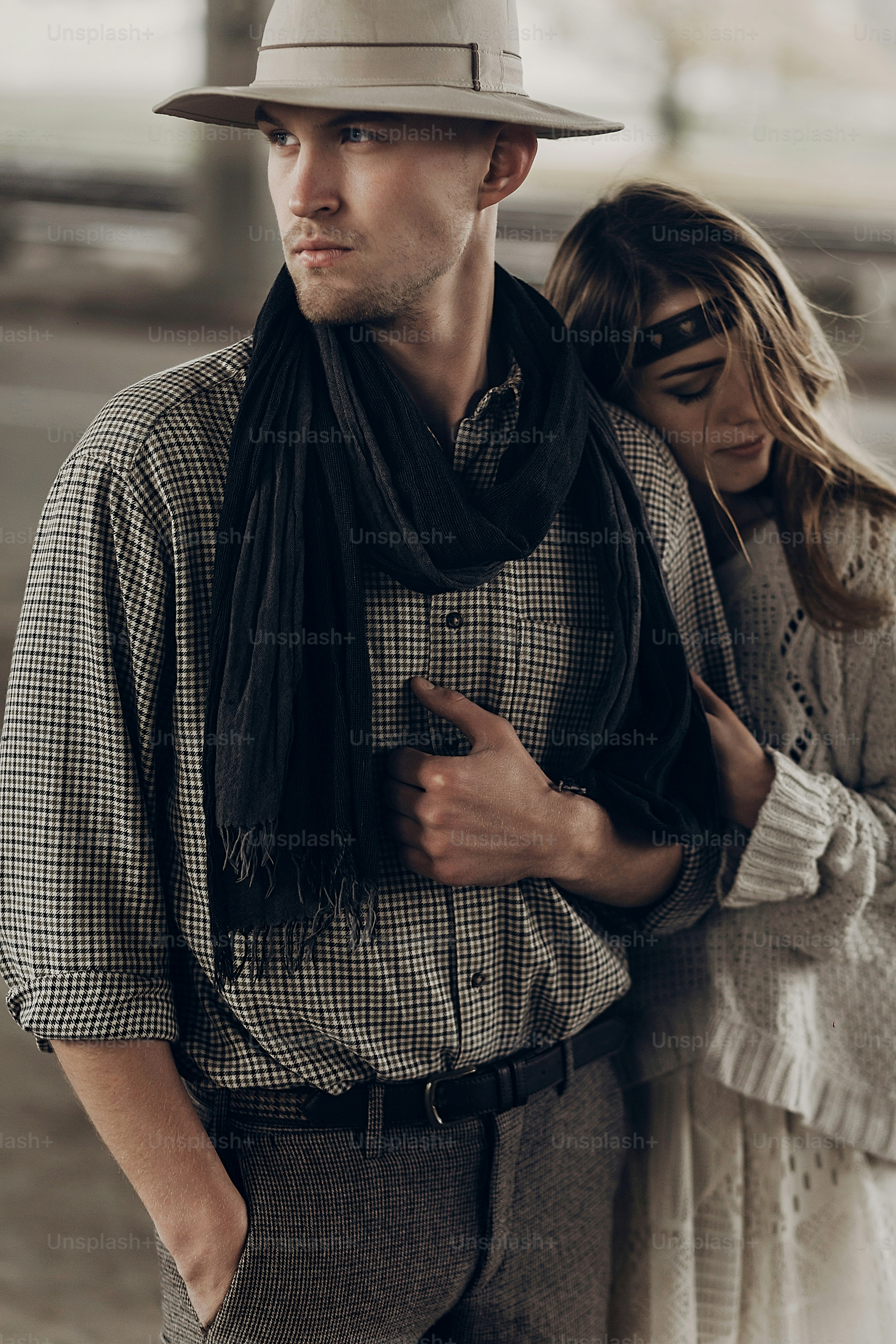 Romantic gypsy woman in stylish boho clothes and white dress hugging ...