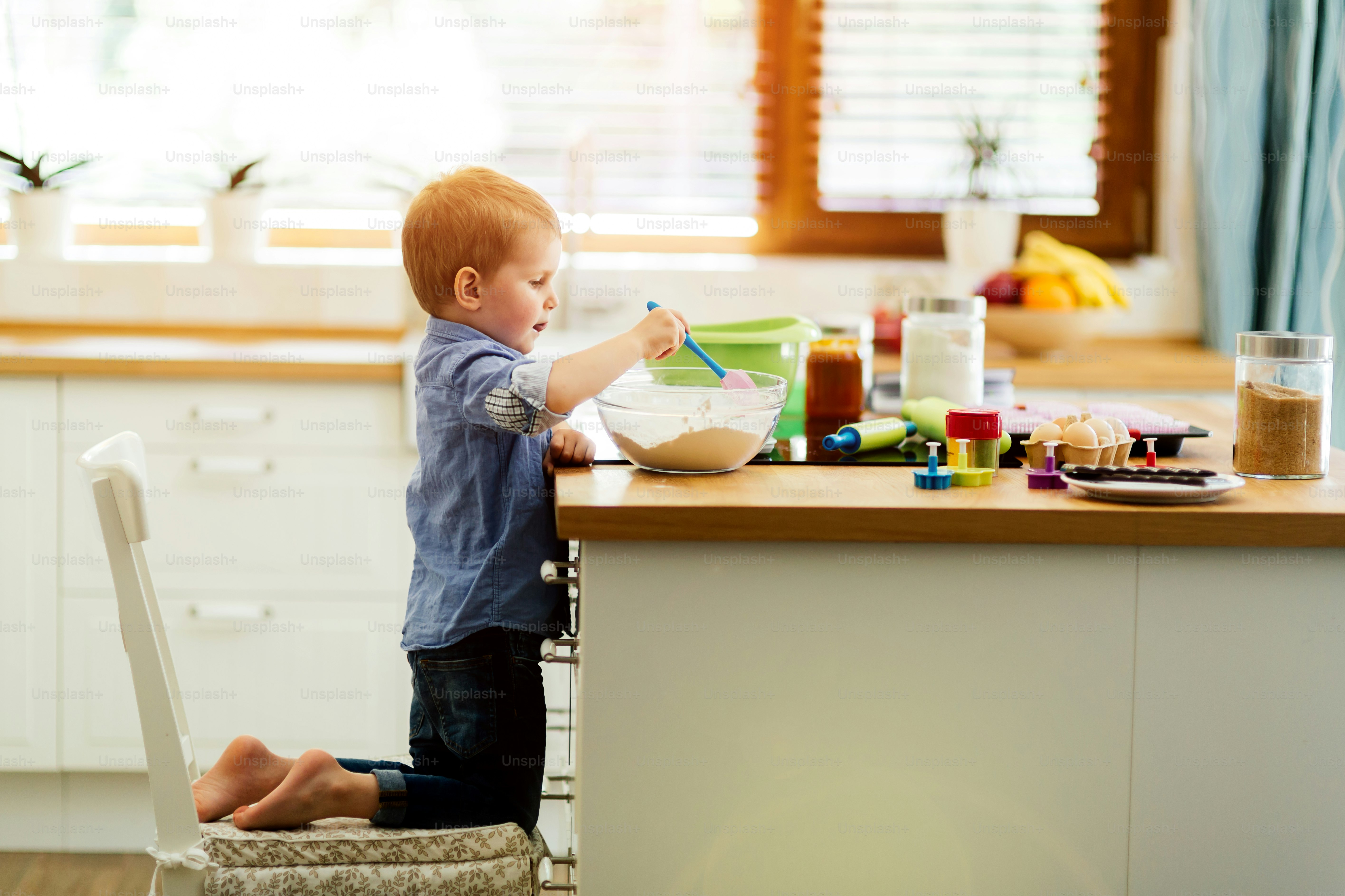 Adorable child below the age of 3 making cookies in kitchen photo – Joy ...