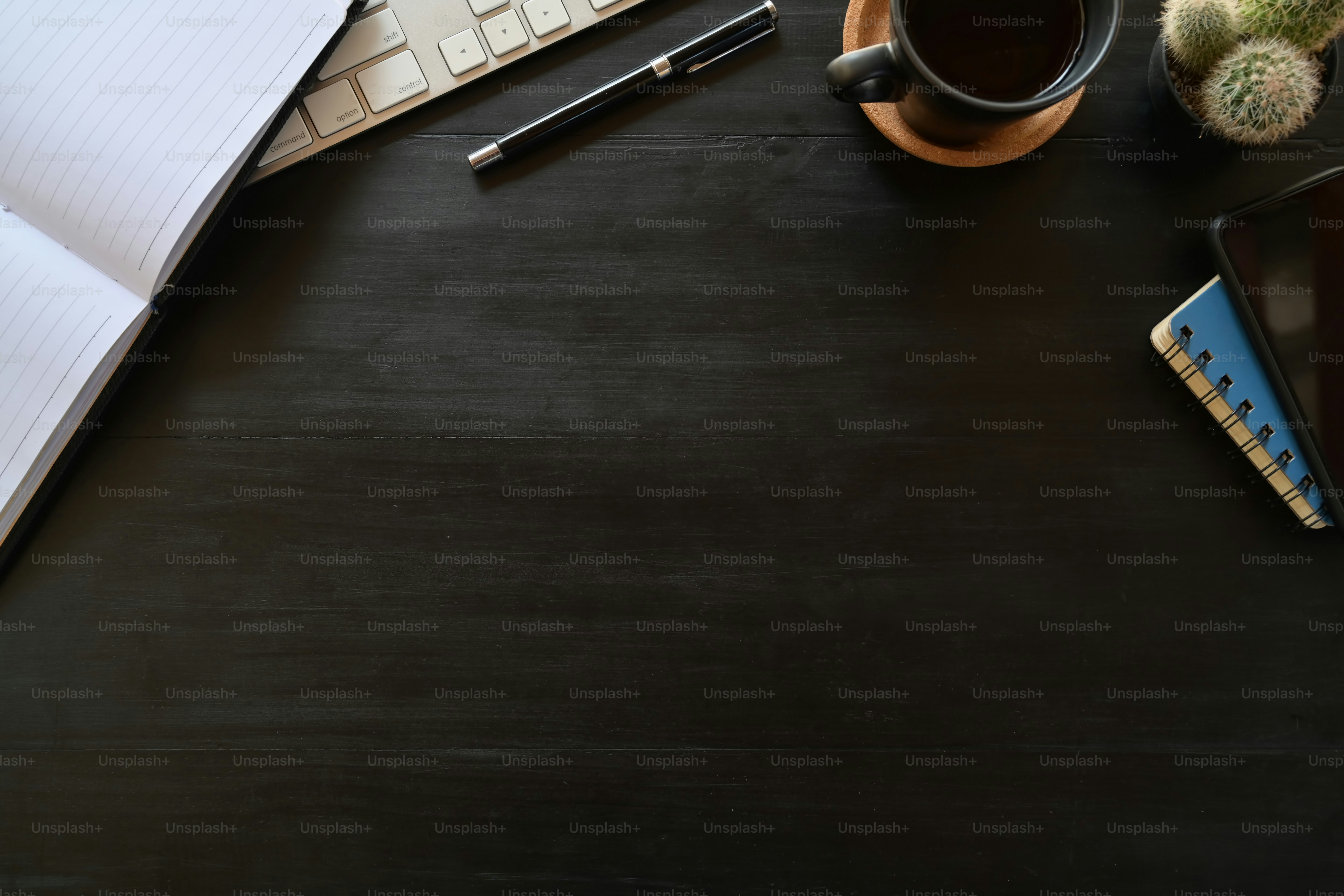 Top view dark wood desktop with office accessories and copy space ...