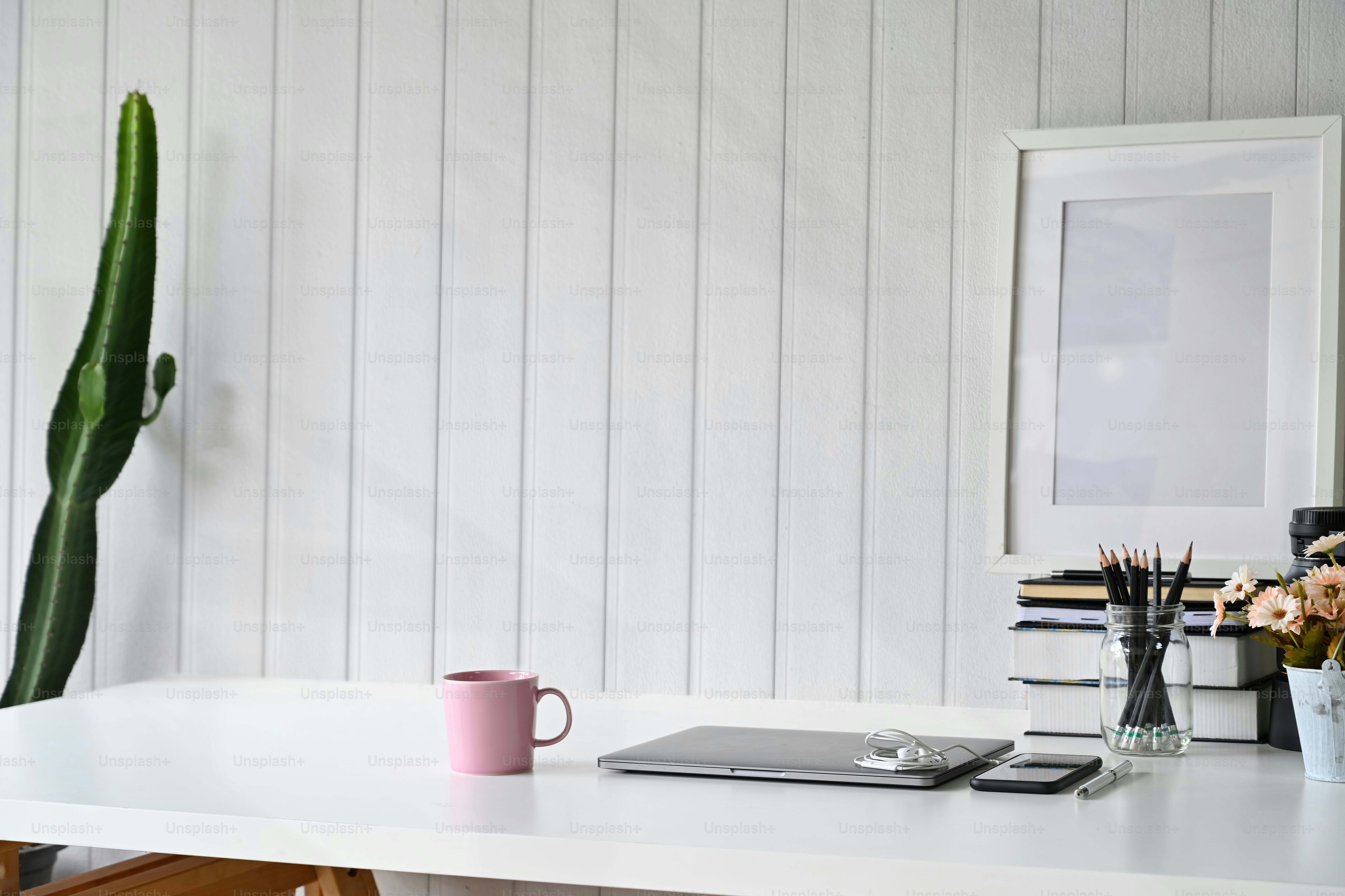 Stylish workspace laptop, poster, home office supplies and copy space ...