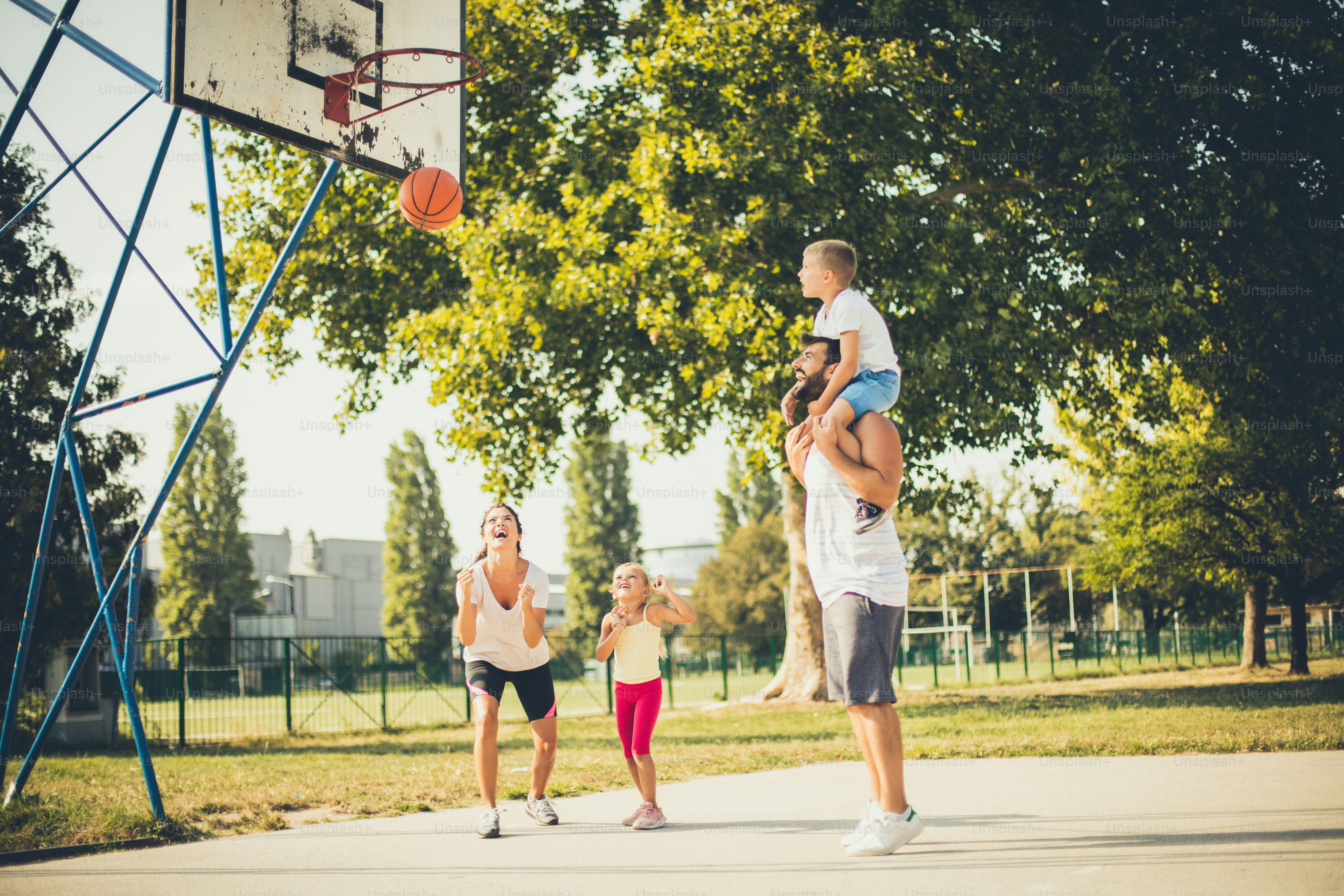 Family basketball. Family playing basketball together. photo – Land ...