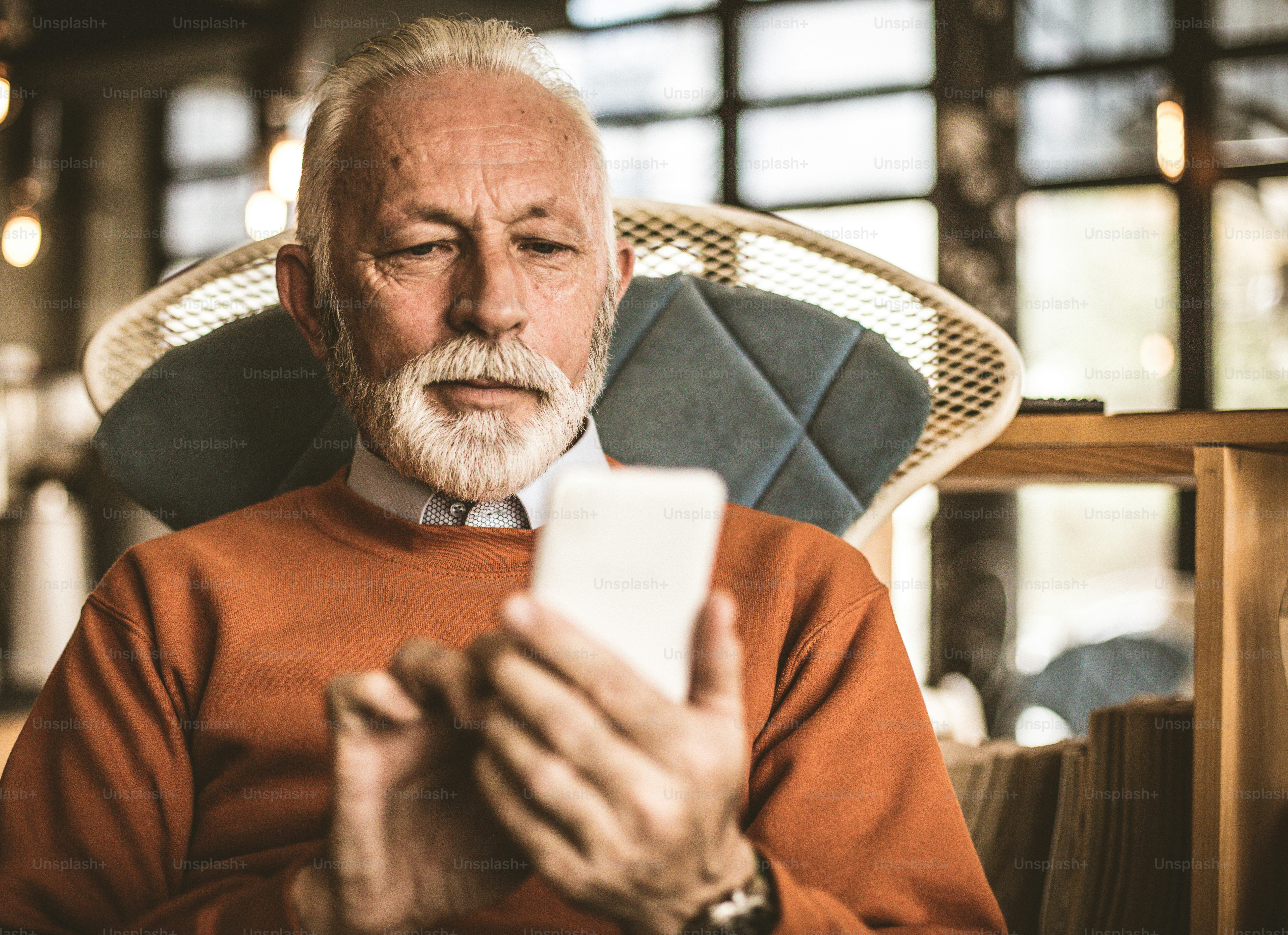 Call a video meeting. Senior business man using phone. Close up. photo ...