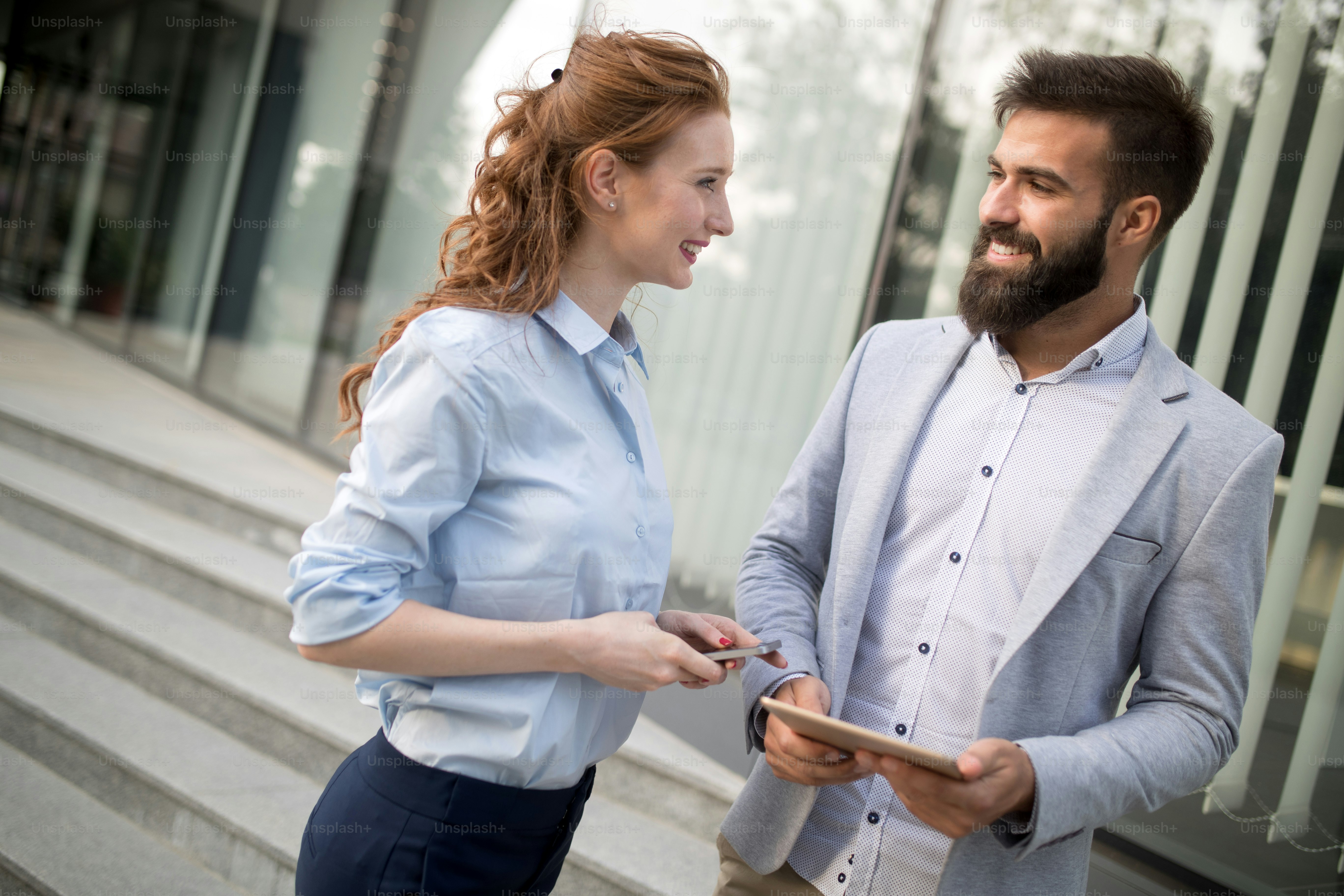Picture of young attractive business partners standing outdoor photo ...