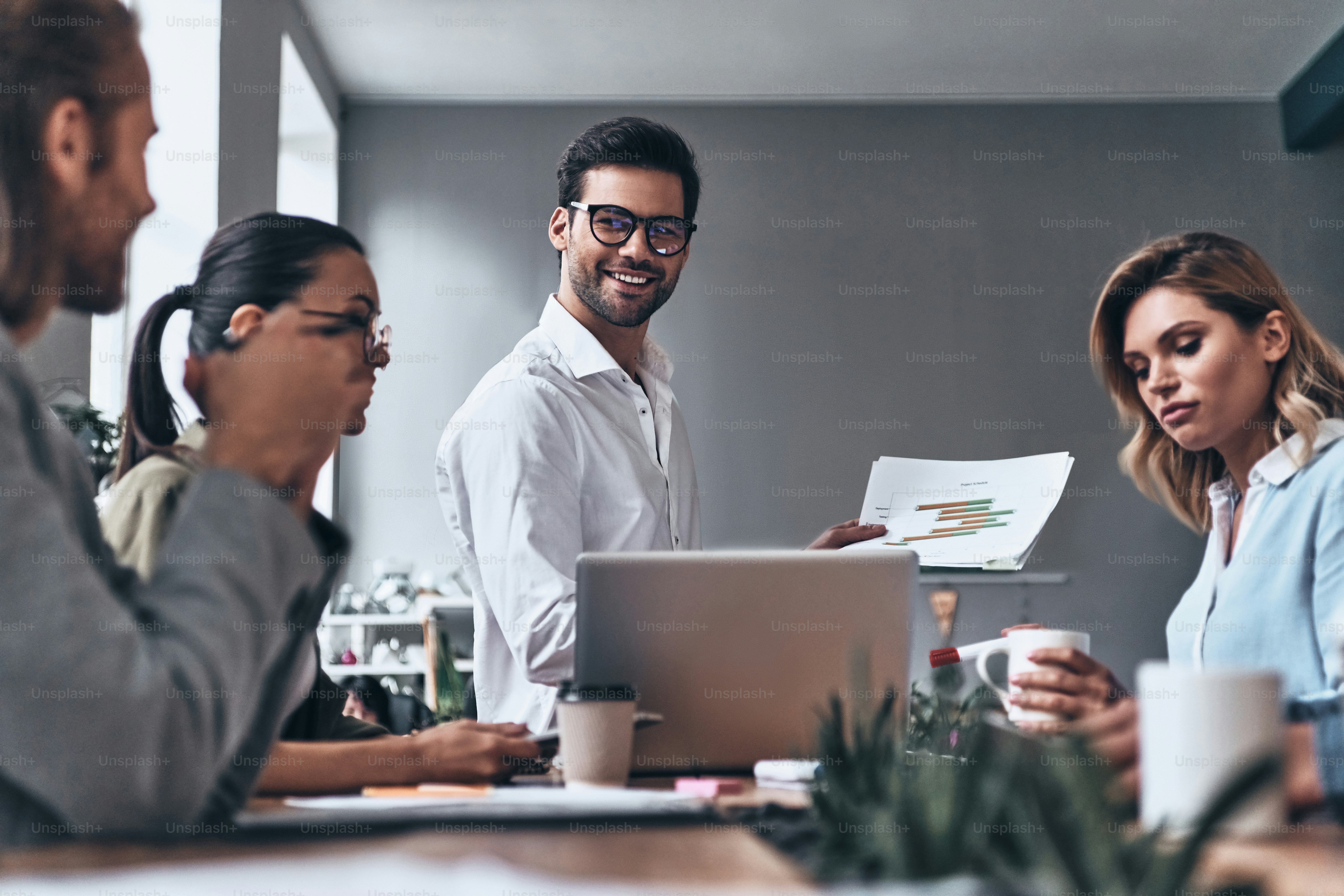 Top view of modern young people discussion business while working in ...