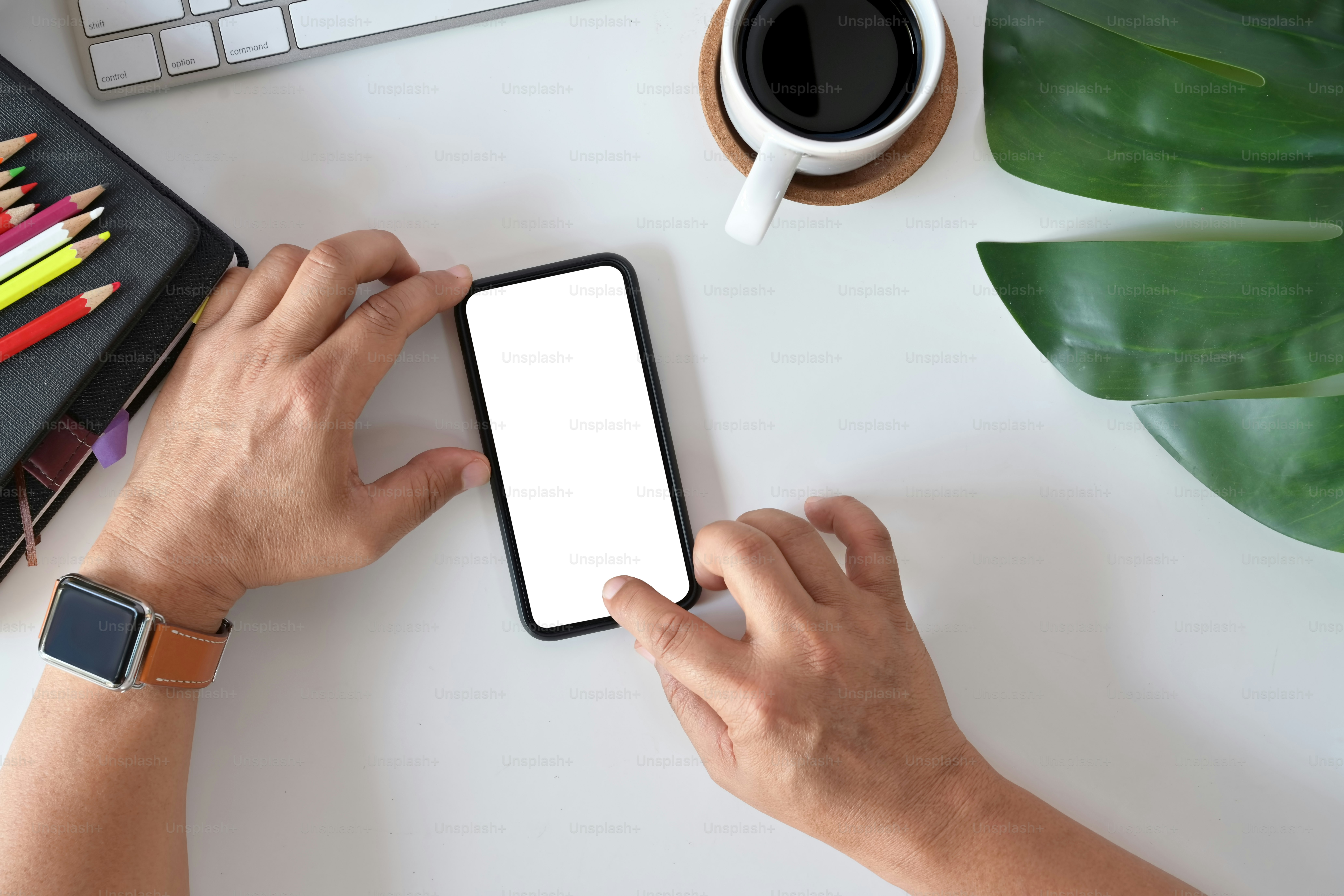 Man using mobile phone in office. Blank screen for display montage ...