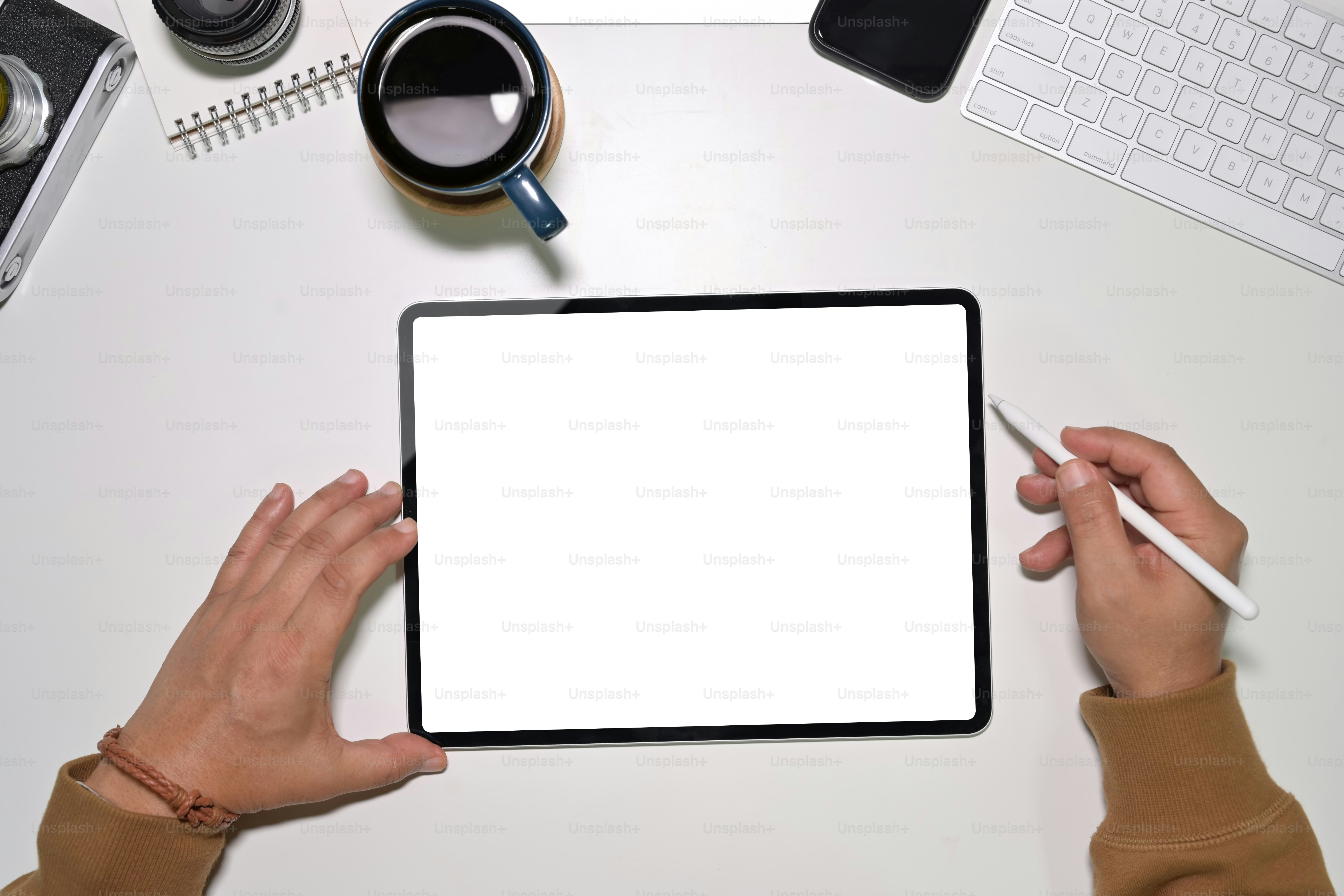 Top view of young man worker using on modern touchscreen tablet photo ...