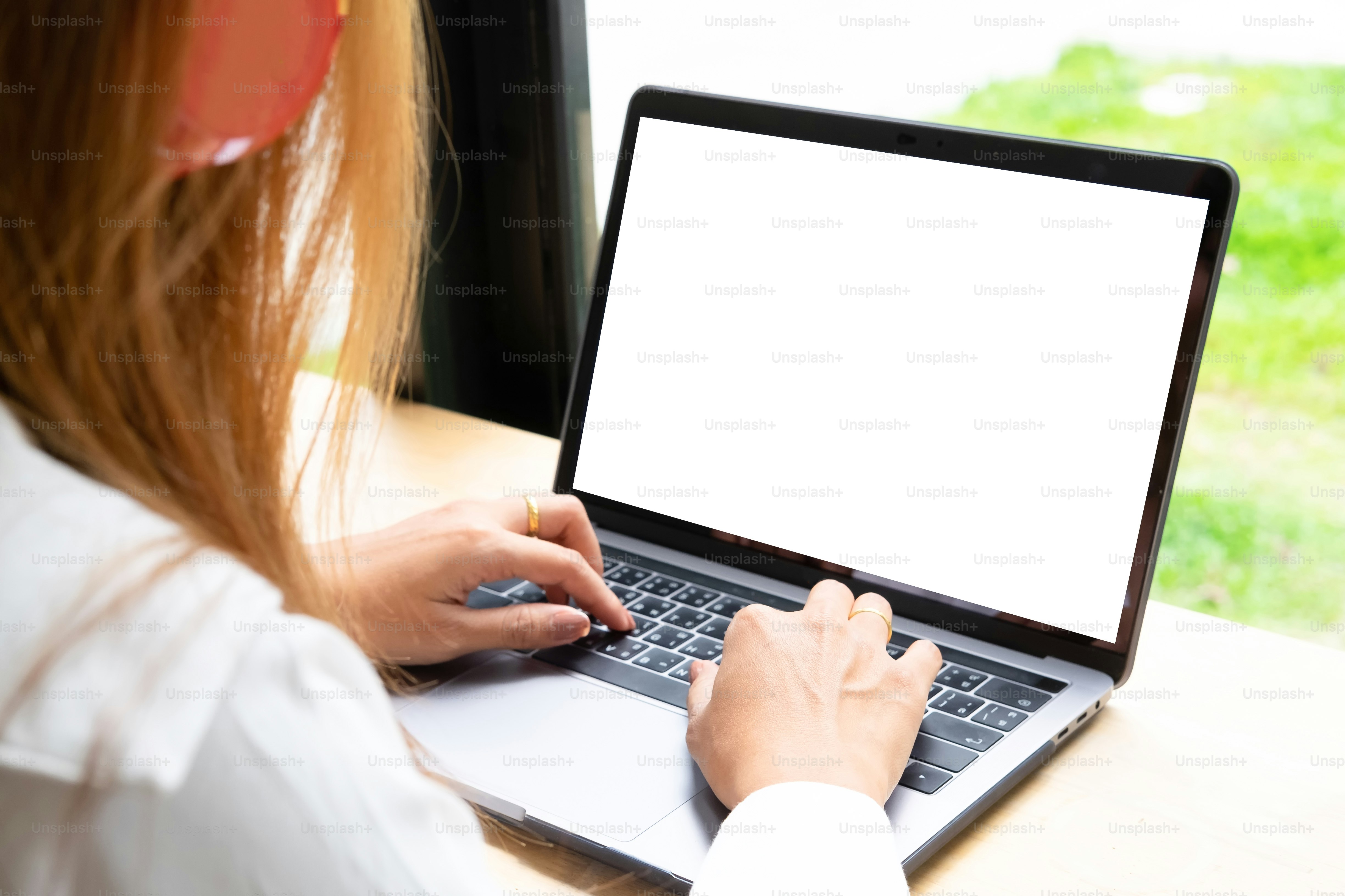 Woman using laptop computer on table. photo – Computer keyboard Image ...