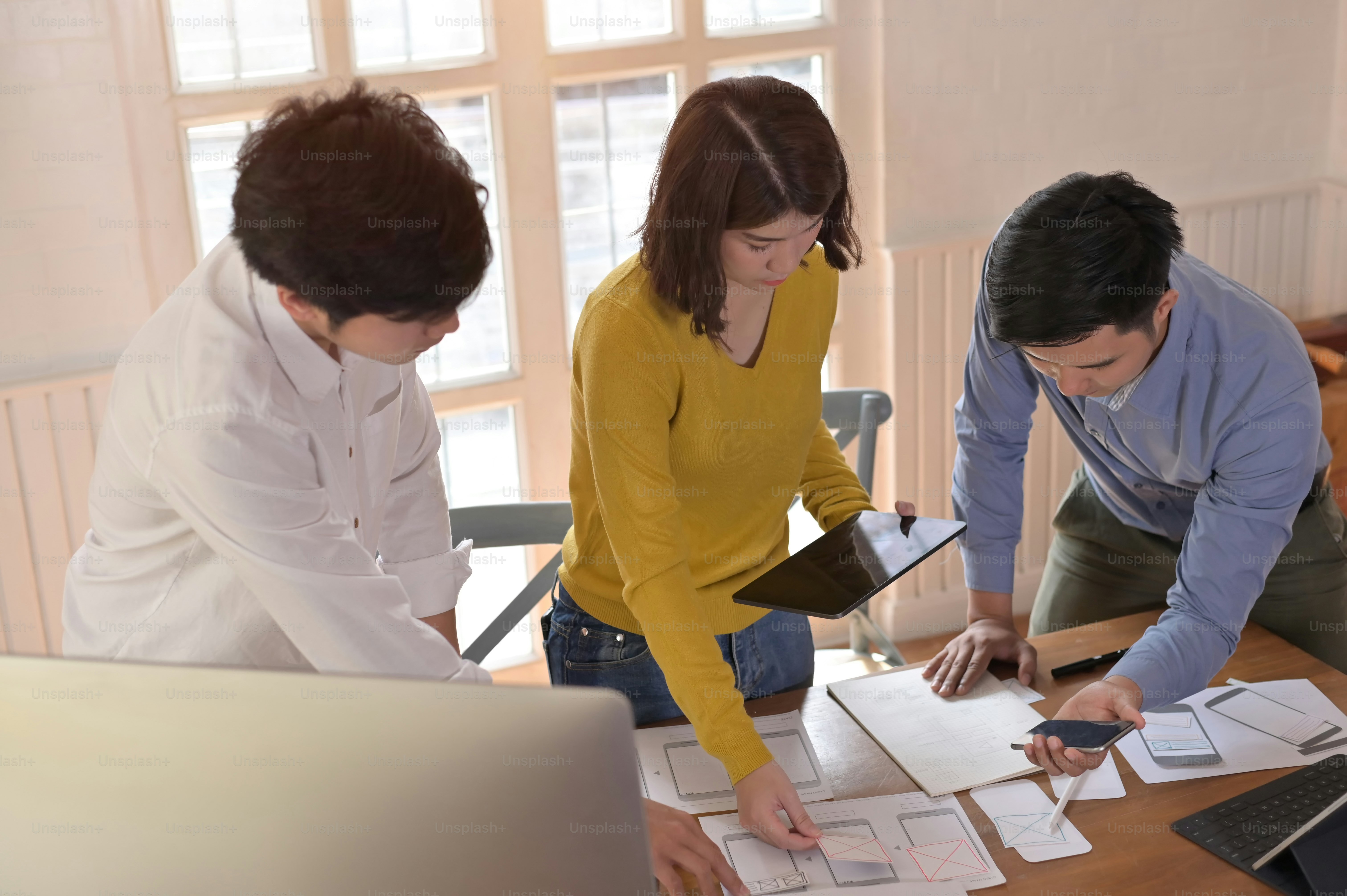 UX UI concept,A team developer working with digital tablet and paper ...