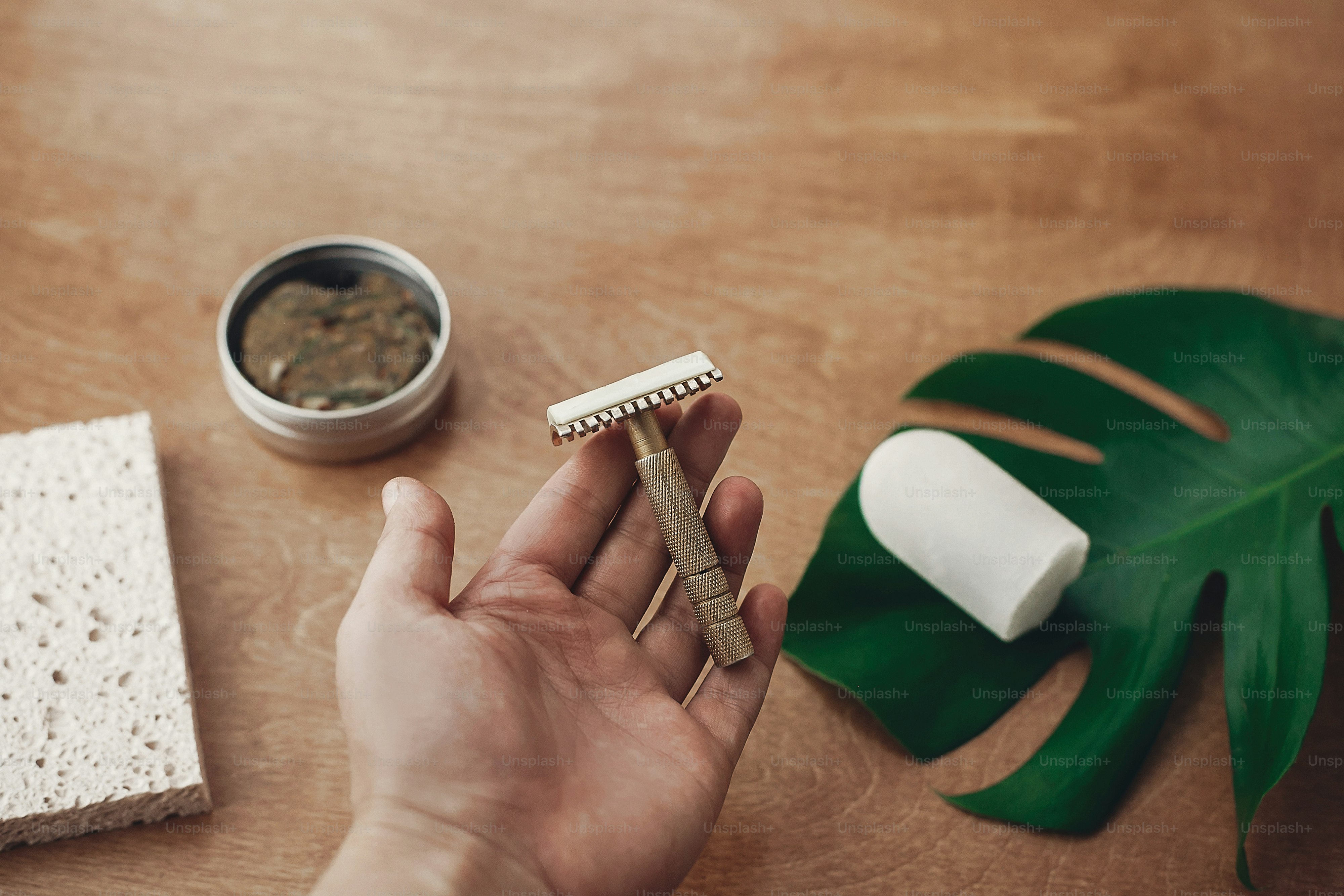 Hand holding reusable vintage razor for shaving on background of ...