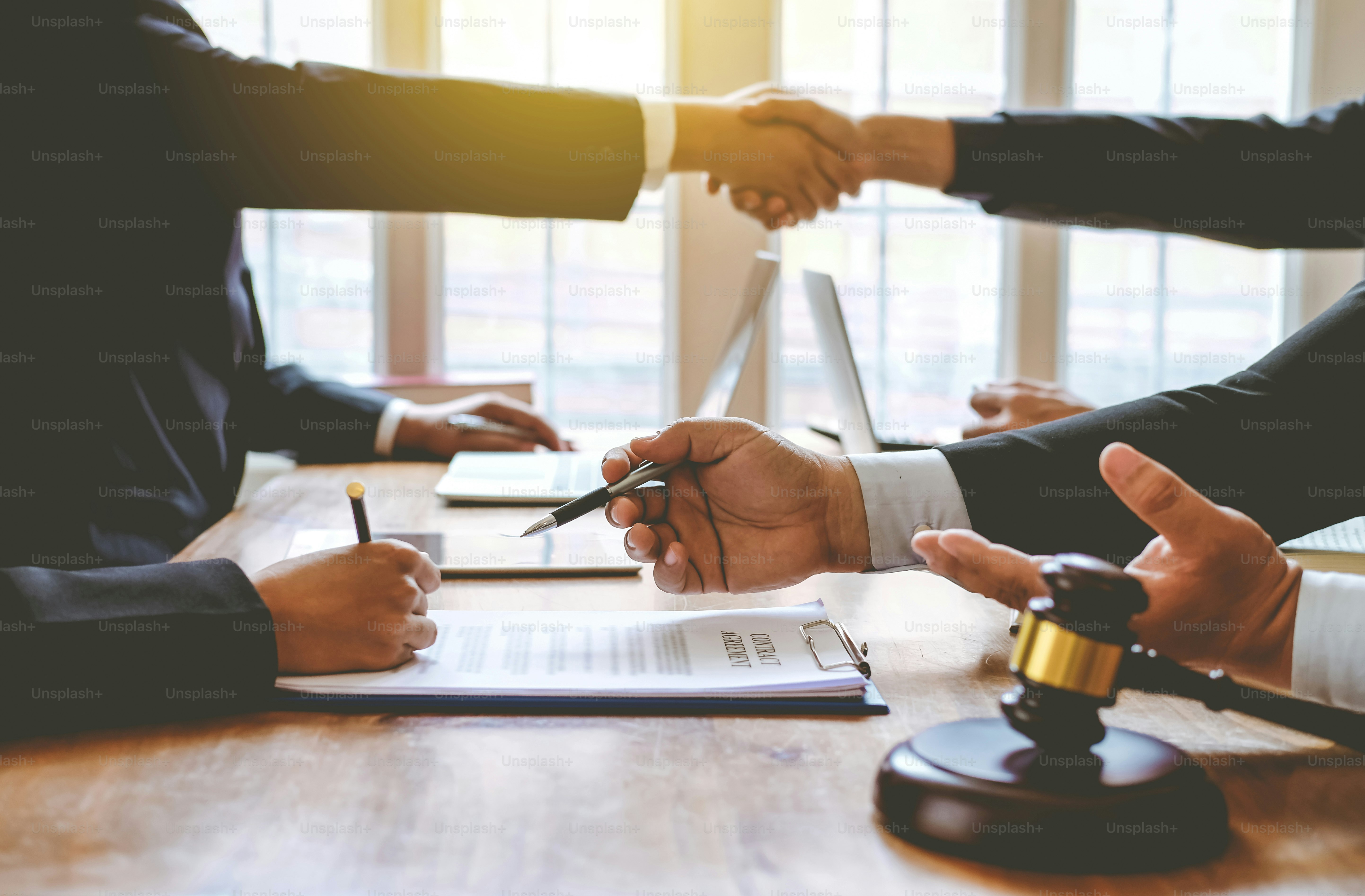 Lawyer give his customers signed a contract in the document. Consulting ...