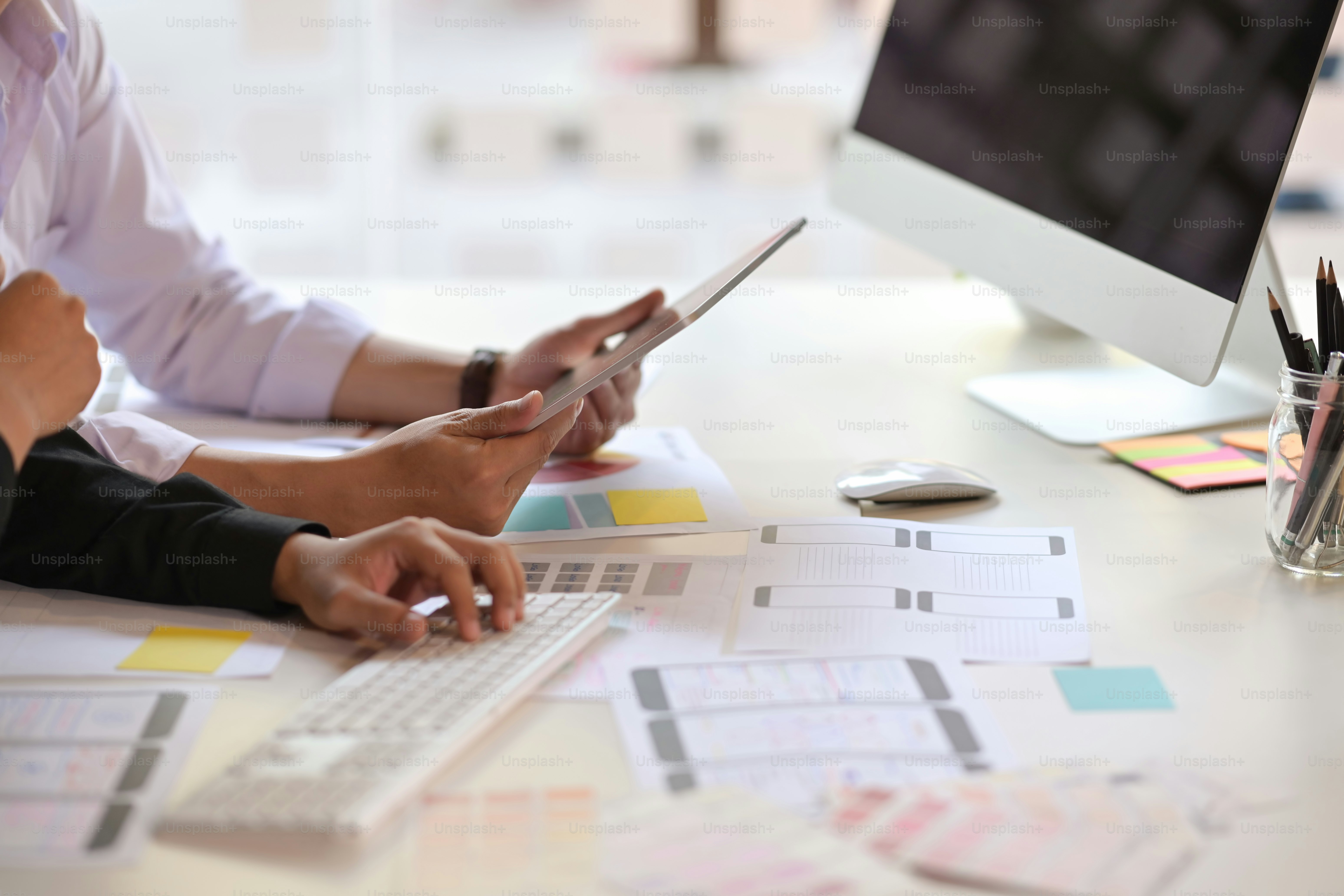 UX designer team using tablet designing wireframe web mobile phone ...