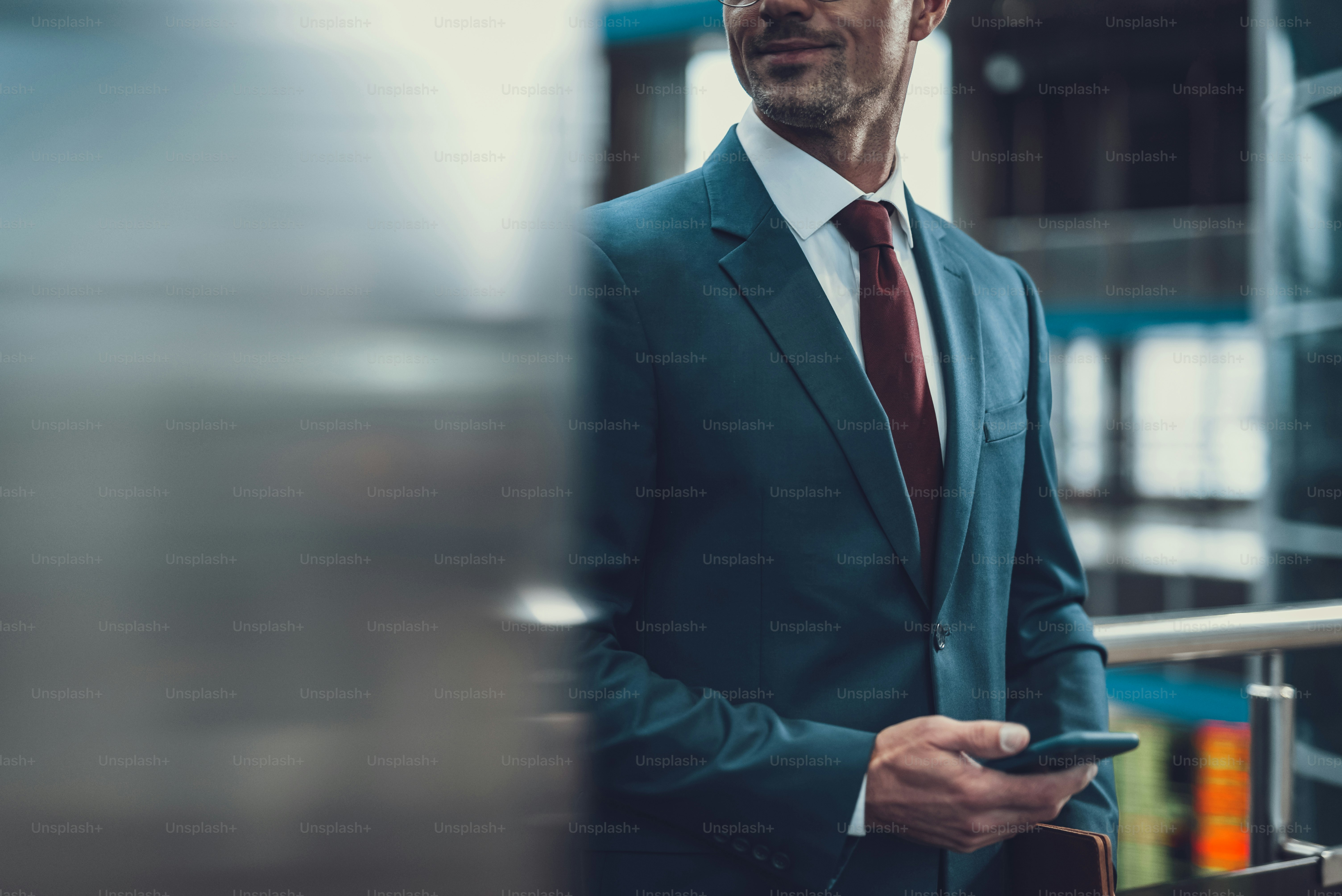 Vertical photo of attractive mature man in chic suit. He standing on ...