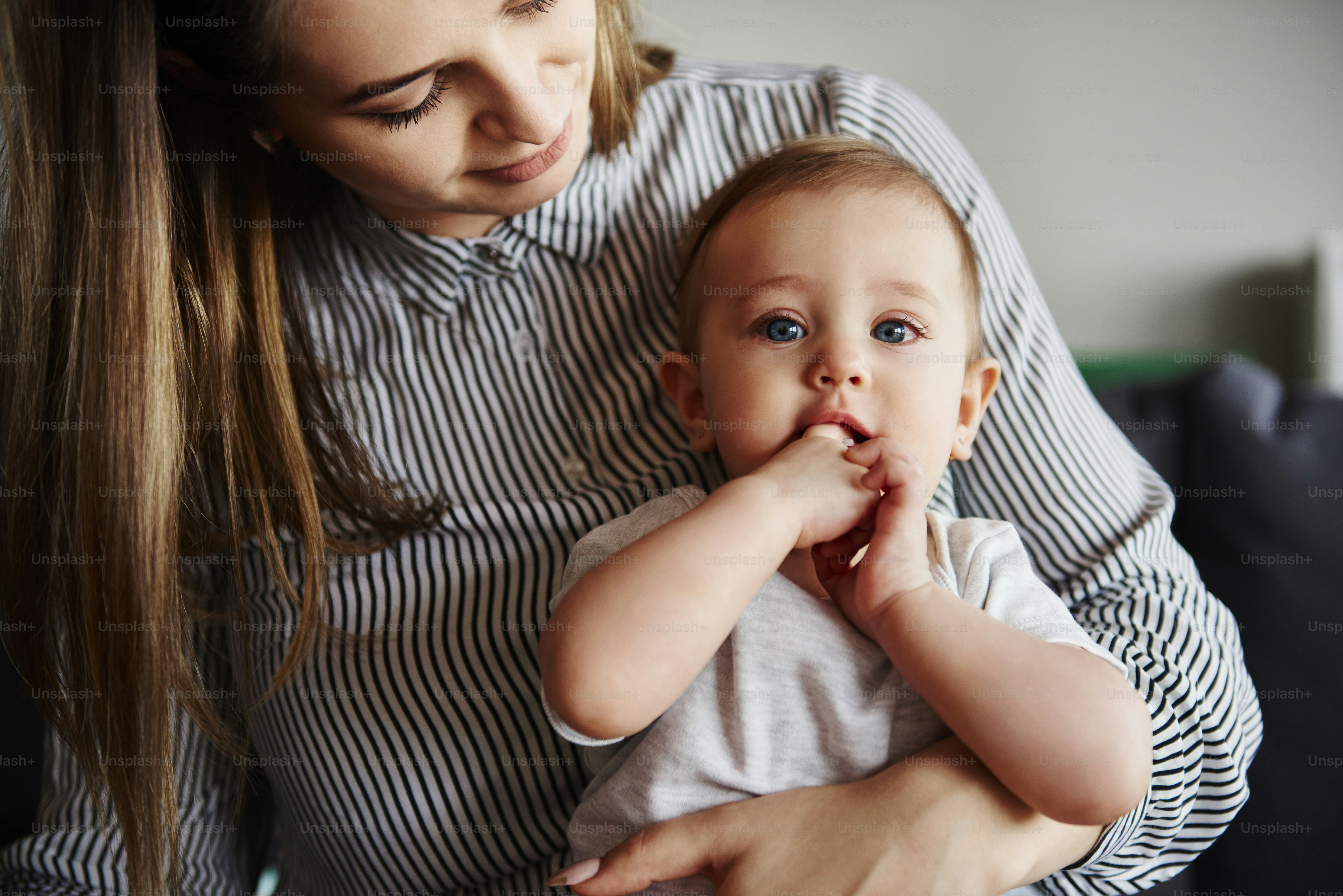 Young mum embracing her little baby girl photo – Portrait Image on Unsplash