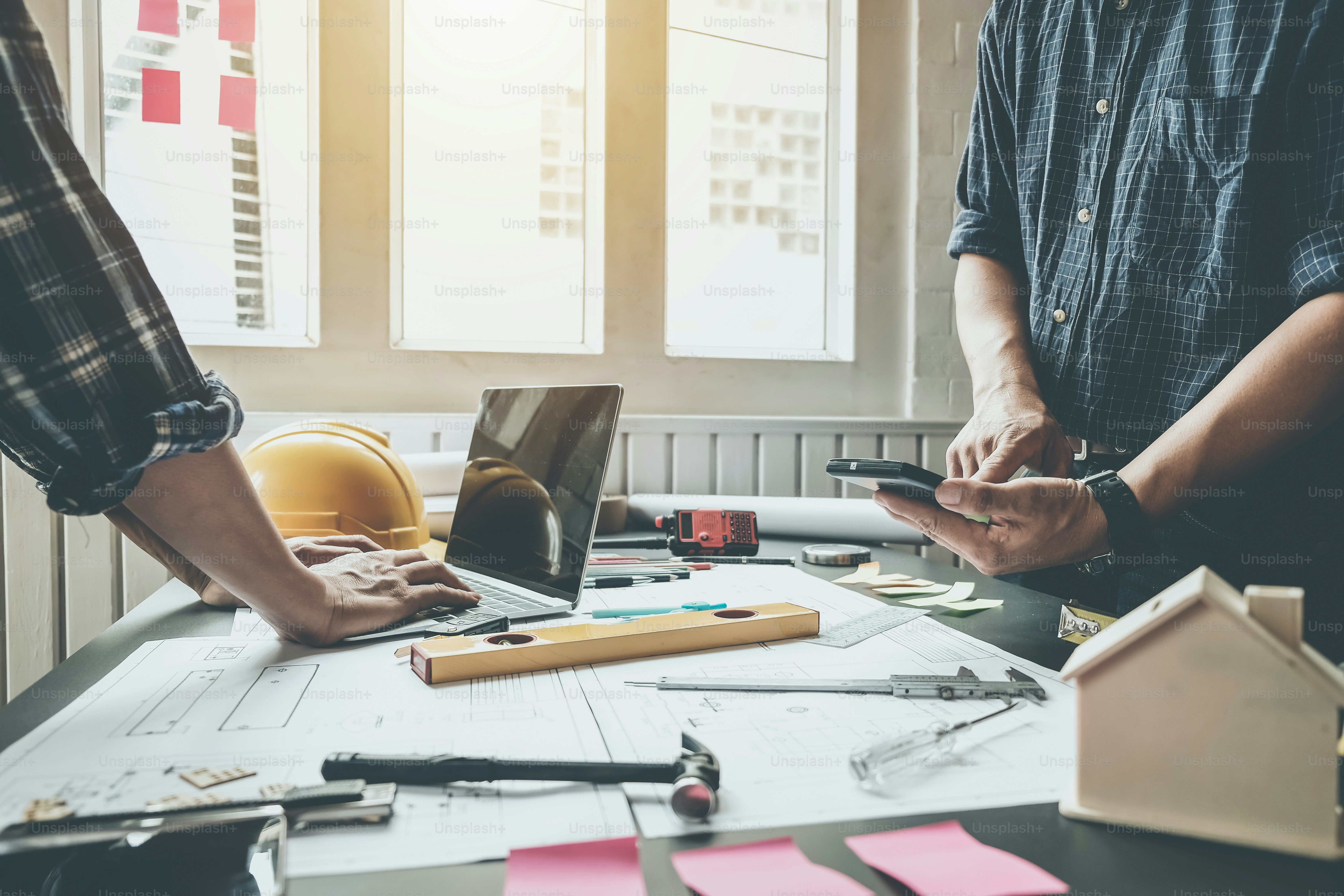 Engineer and contractor planning projects together at the meeting ...