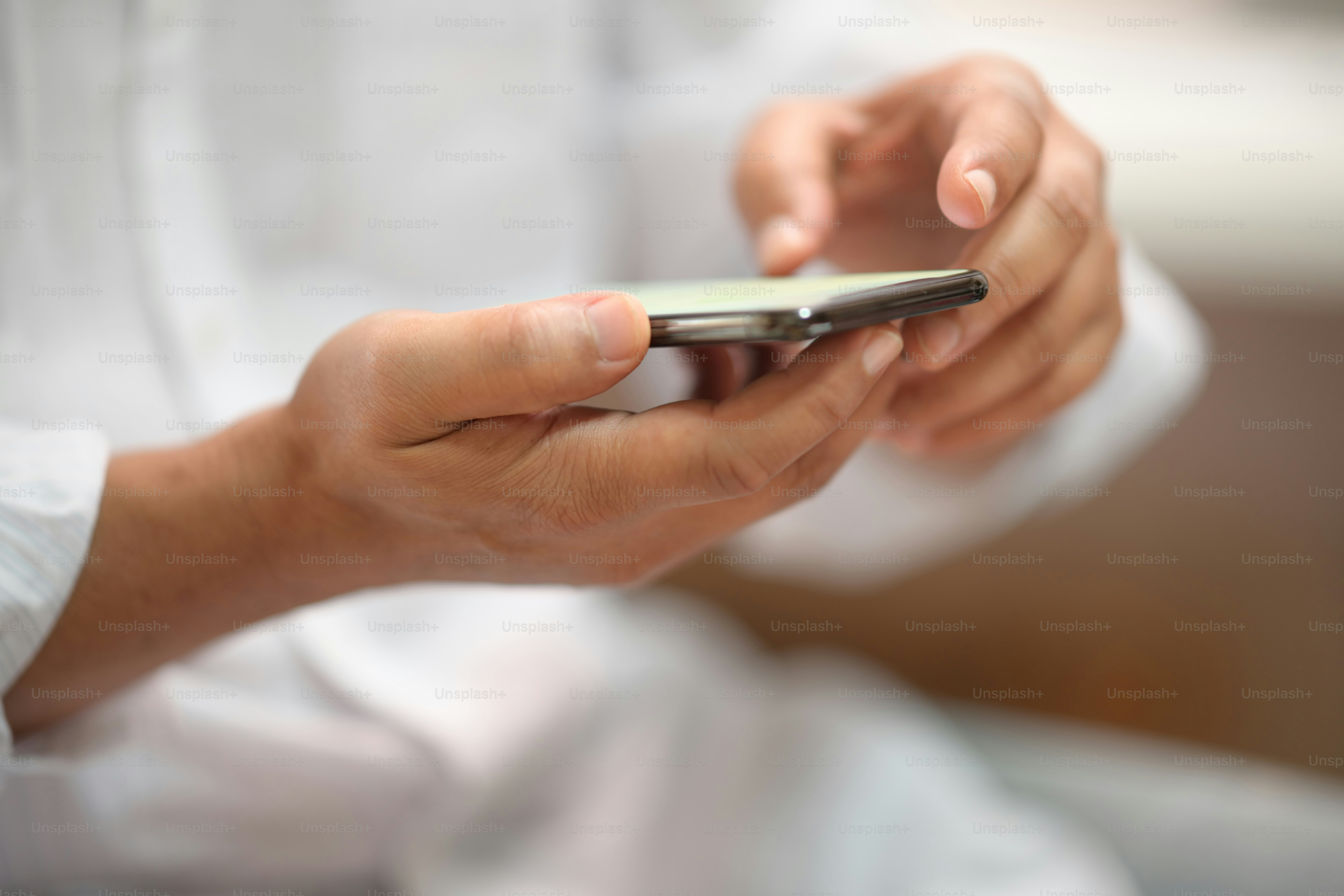 Close up of man using mobile smartphone photo – Social media Image on ...