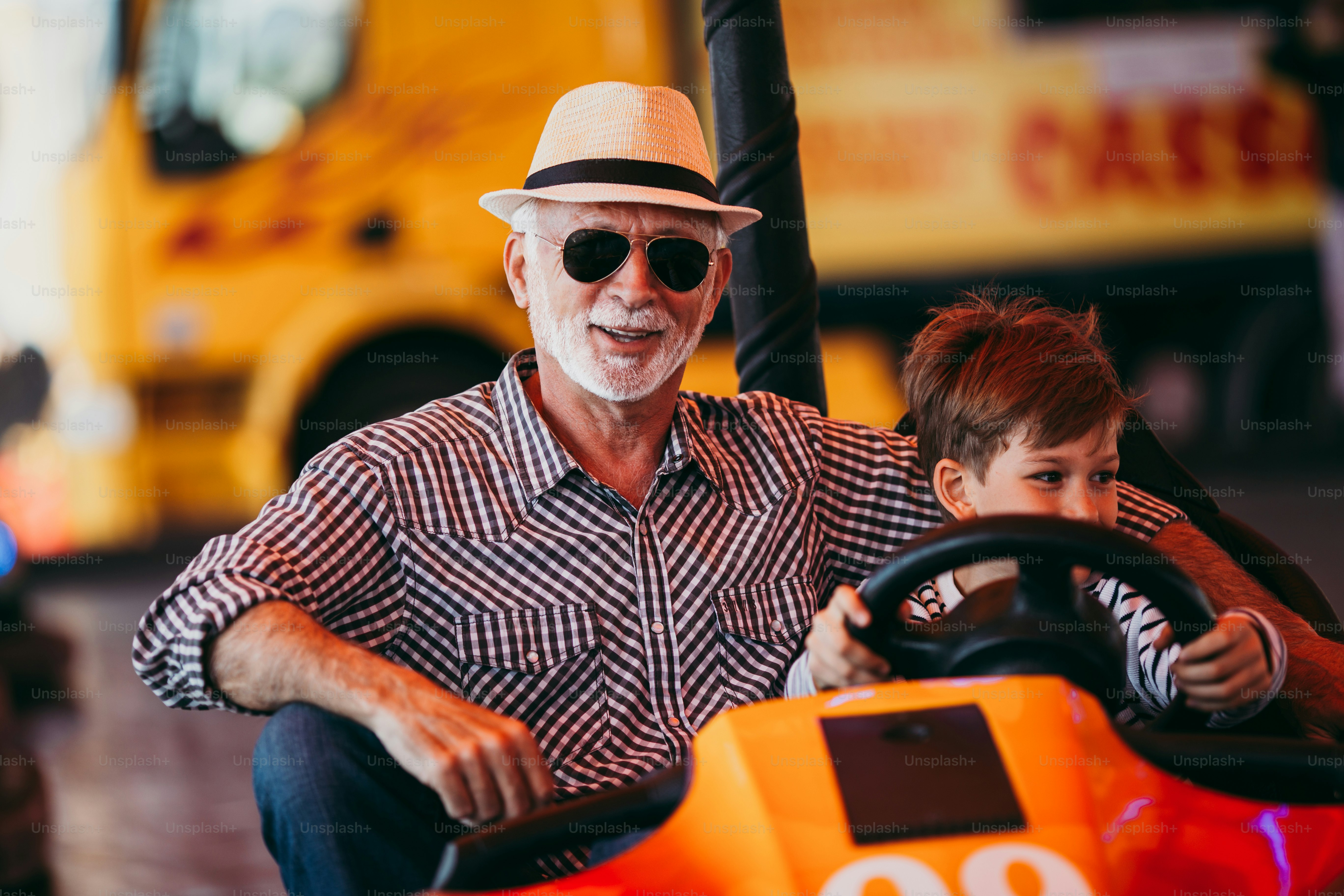 Grandfather and grandson having fun and spending good quality time ...