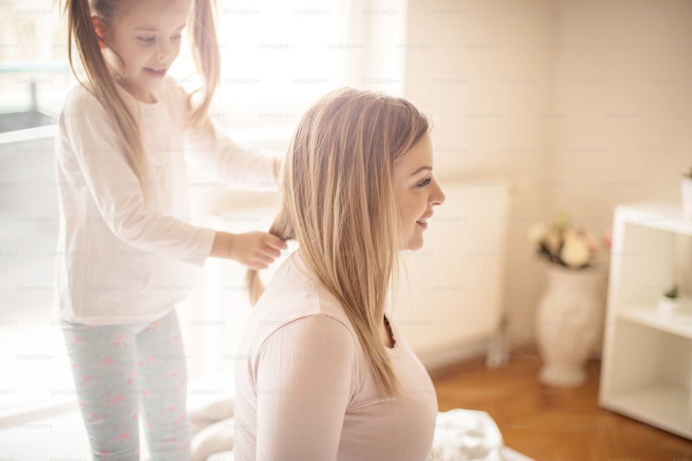 You will beautiful. Daughter making hairdo to mother. photo – Serbia ... You will beautiful. Daughter making hairdo to mother. photo – Serbia ...